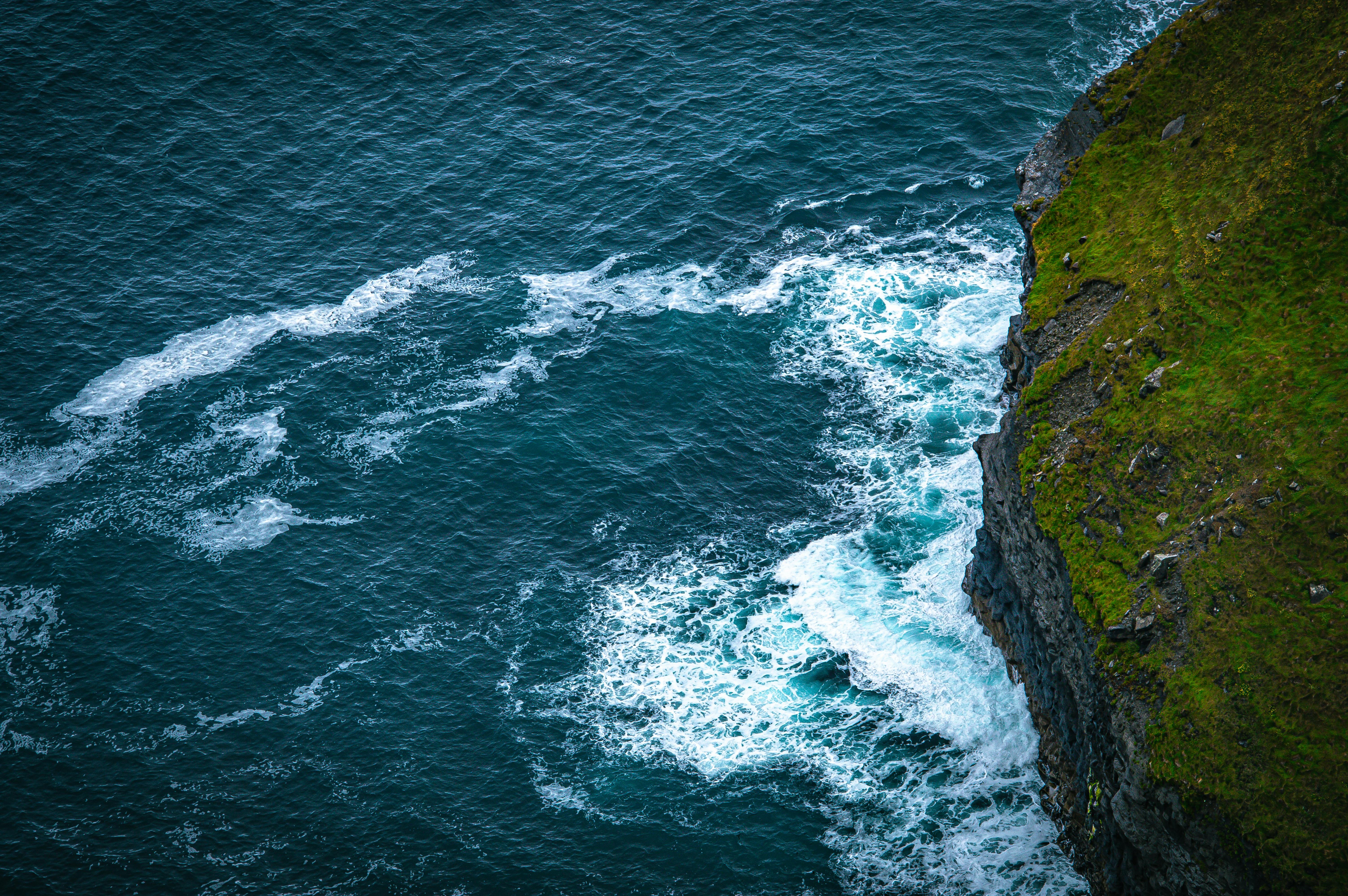 Dramatic Cliffside with Ocean Waves · Free Stock Photo