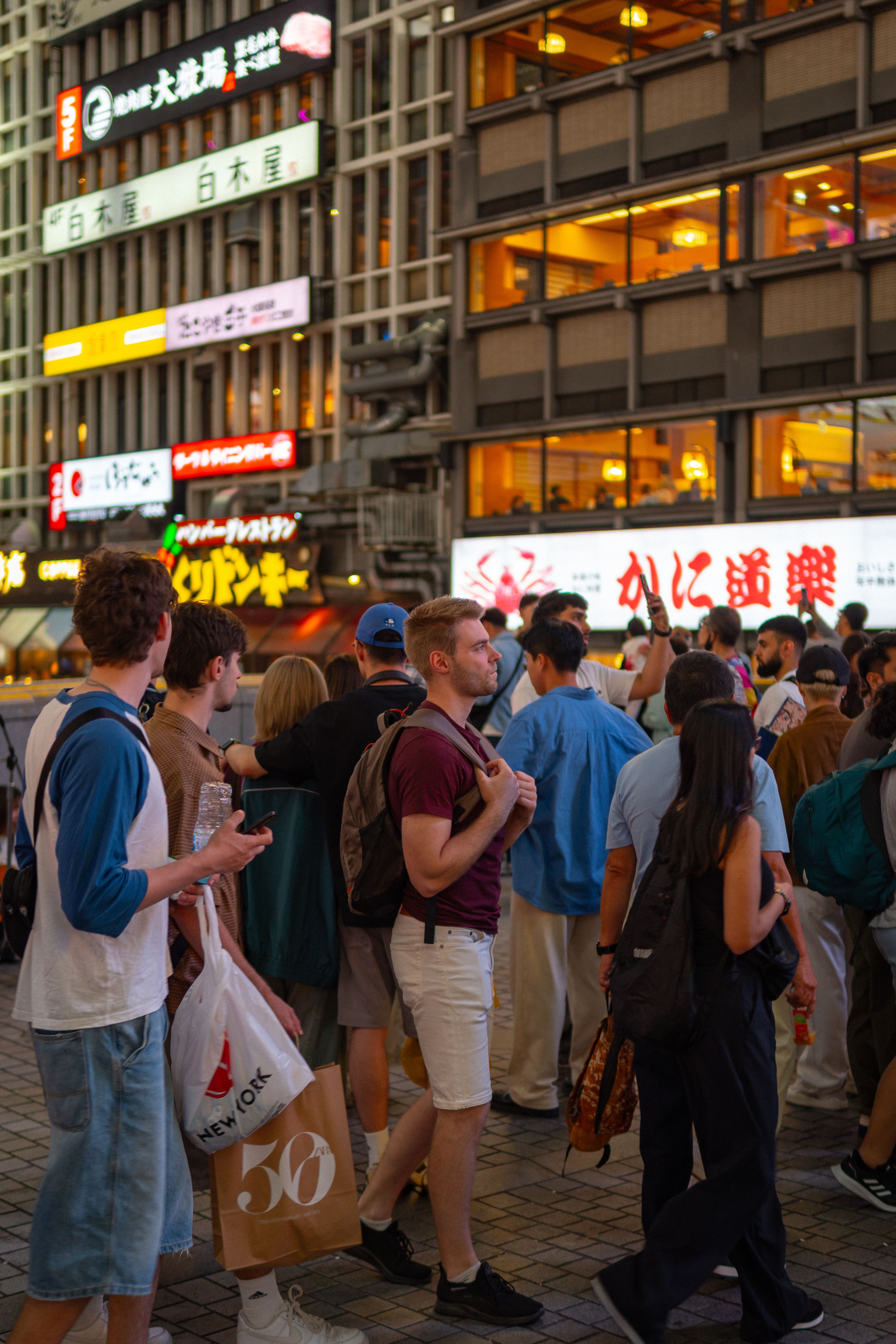 Busy Urban Scene with People at Night · Free Stock Photo