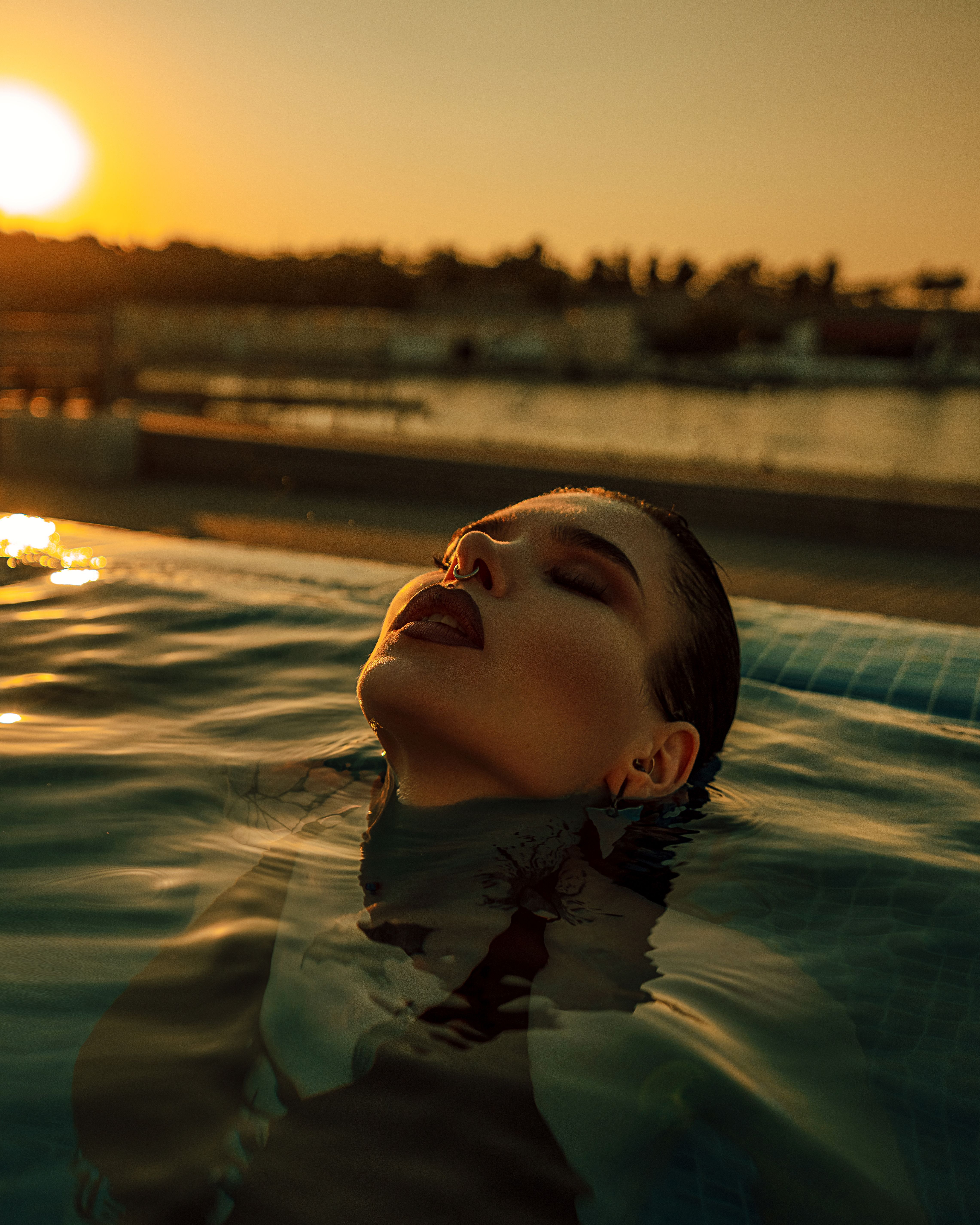 Serene Sunset Poolside Relaxation Scene · Free Stock Photo