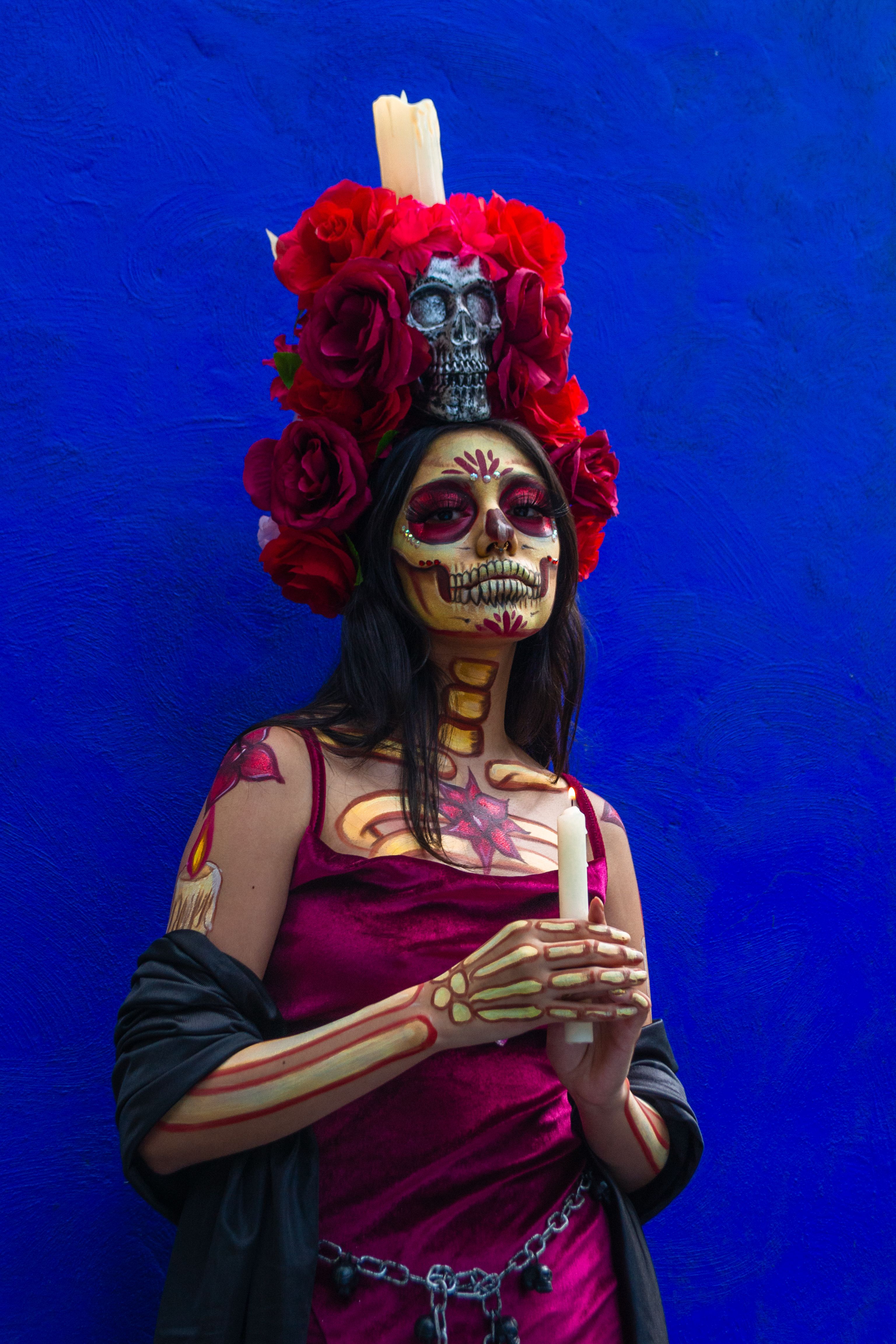Vibrant Catrina Costume Against Blue Background · Free Stock Photo