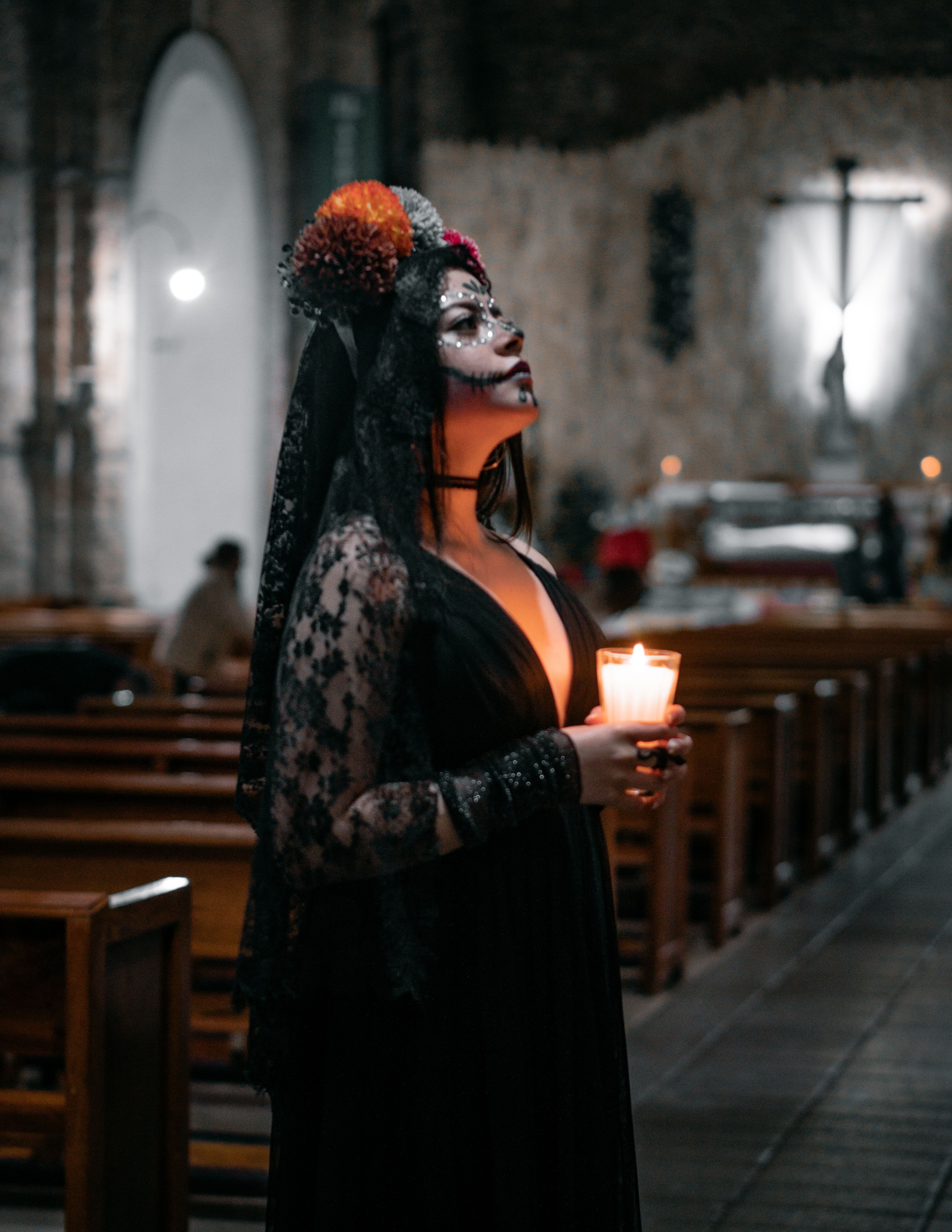 Celebrating Day of the Dead in a Dimly Lit Church · Free Stock Photo