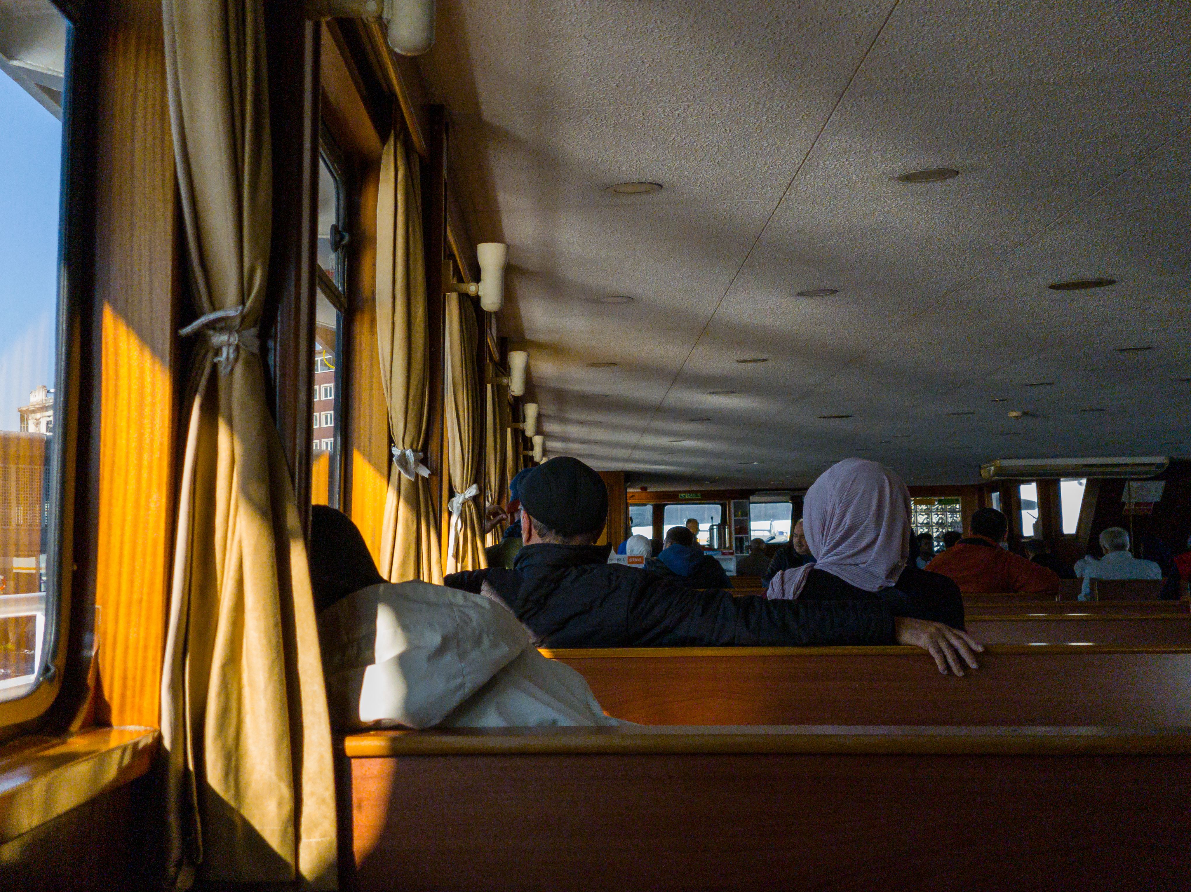 Cozy Ferry Interior with Passengers Relaxing · Free Stock Photo