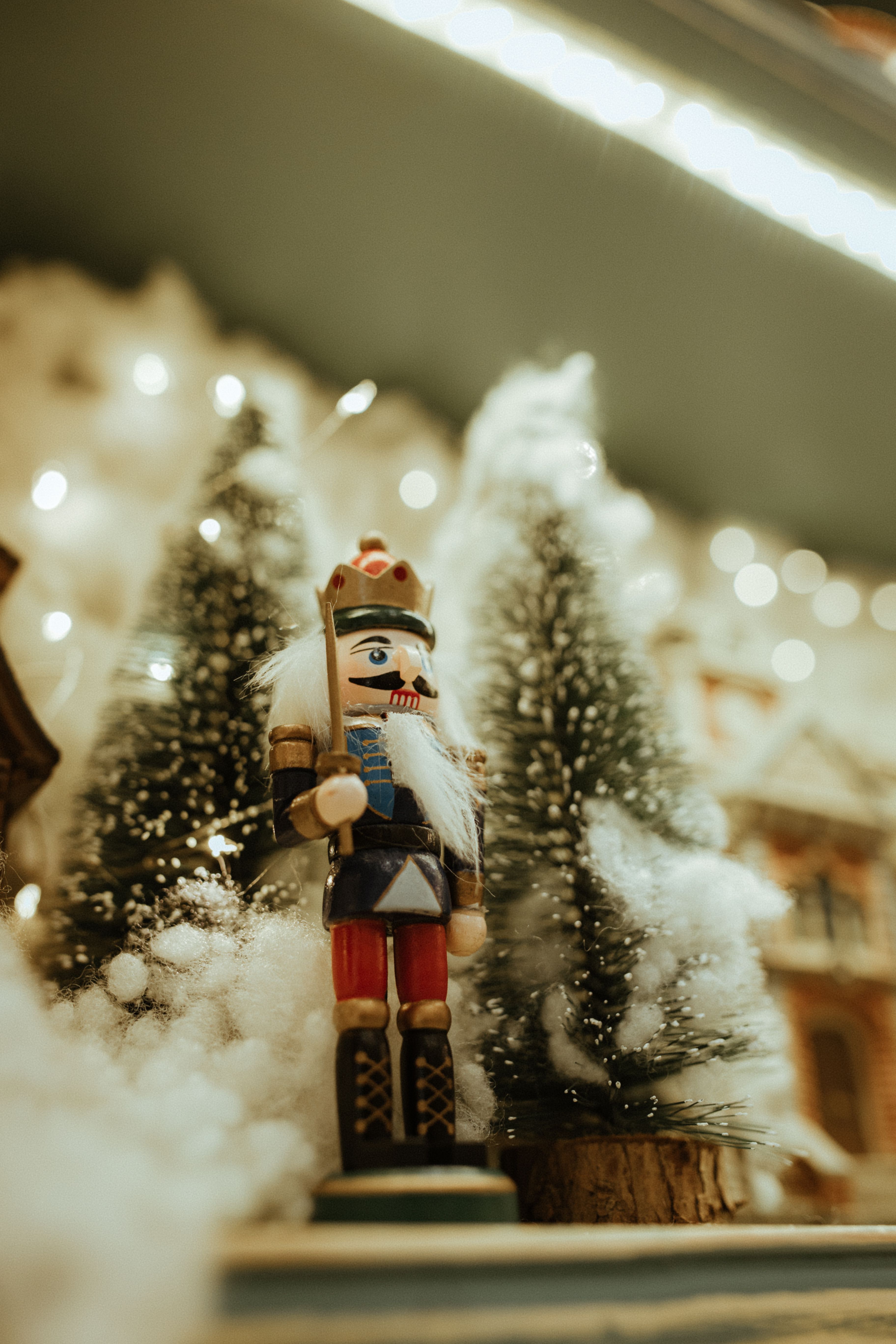 Festive Nutcracker Figurine in Winter Wonderland · Free Stock Photo