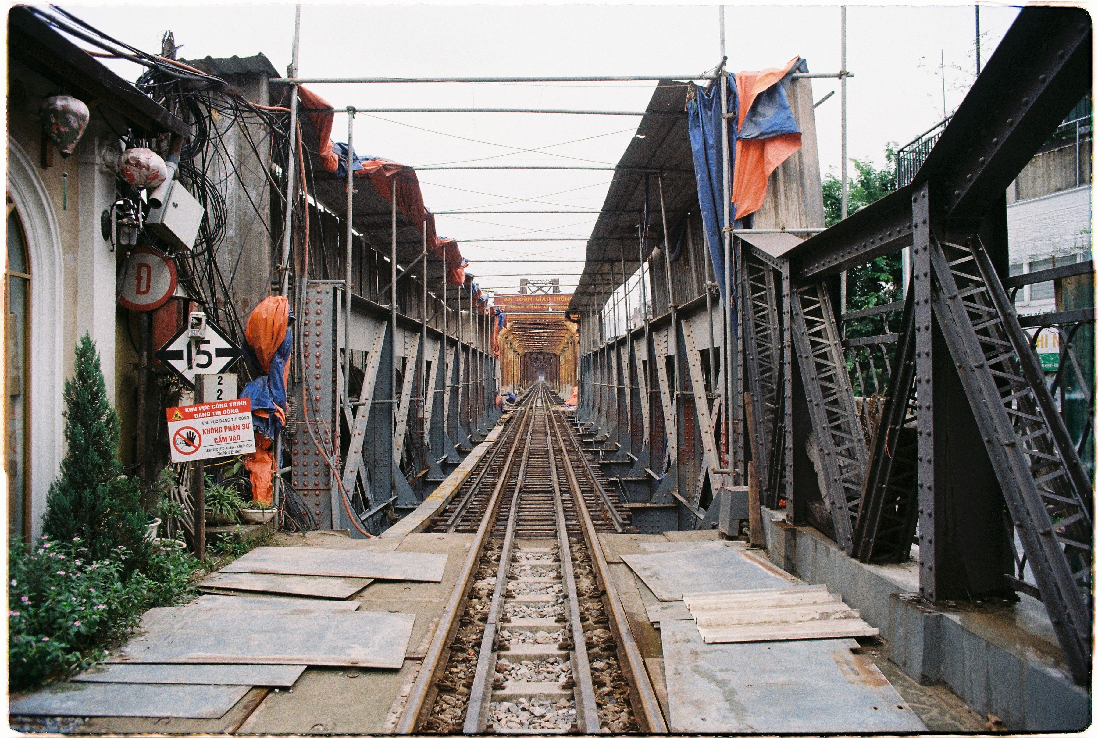 Urban Train Tracks Through Iron Bridge · Free Stock Photo