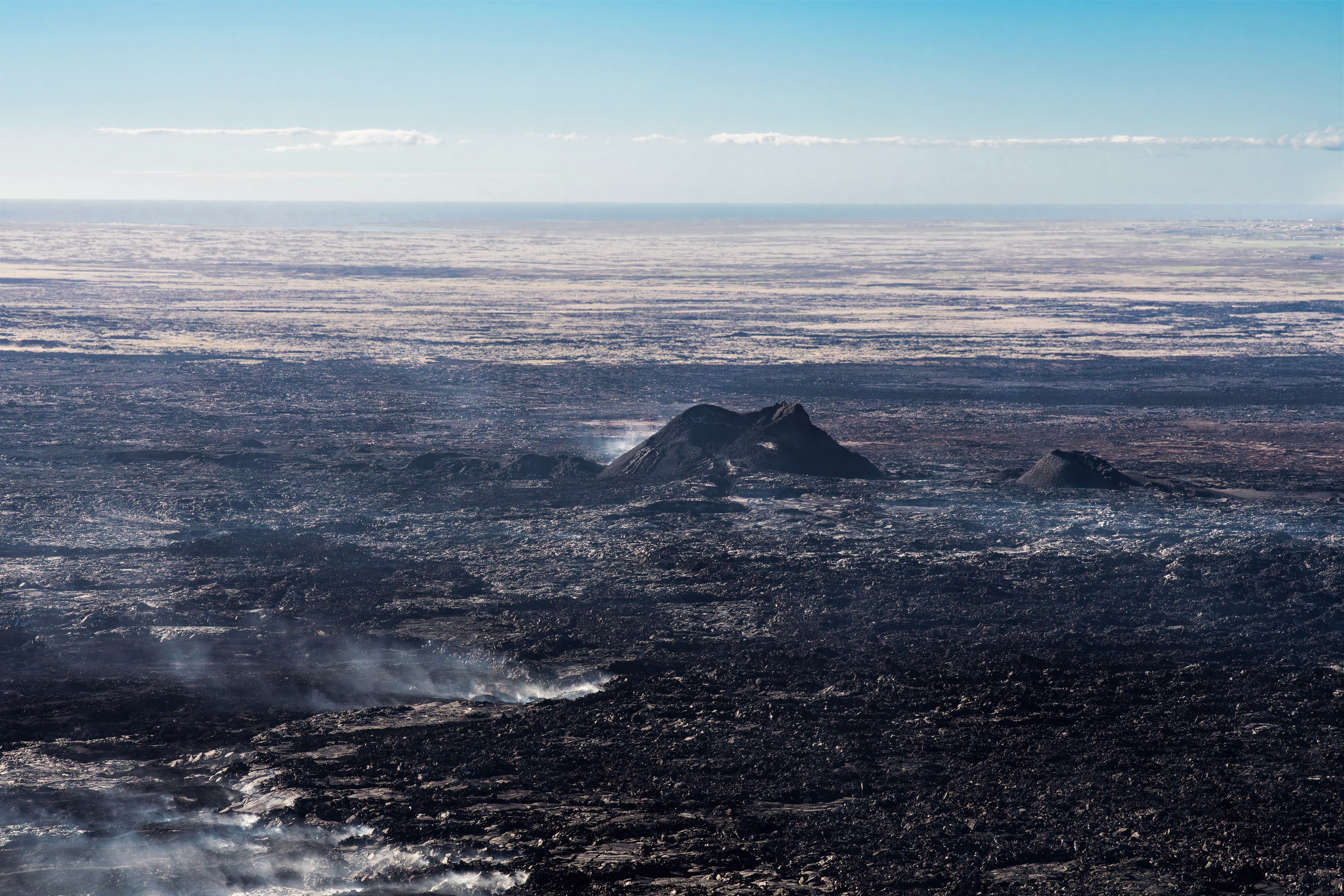 Aerial View of Volcanic Landscape with Erupting Lava · Free Stock Photo