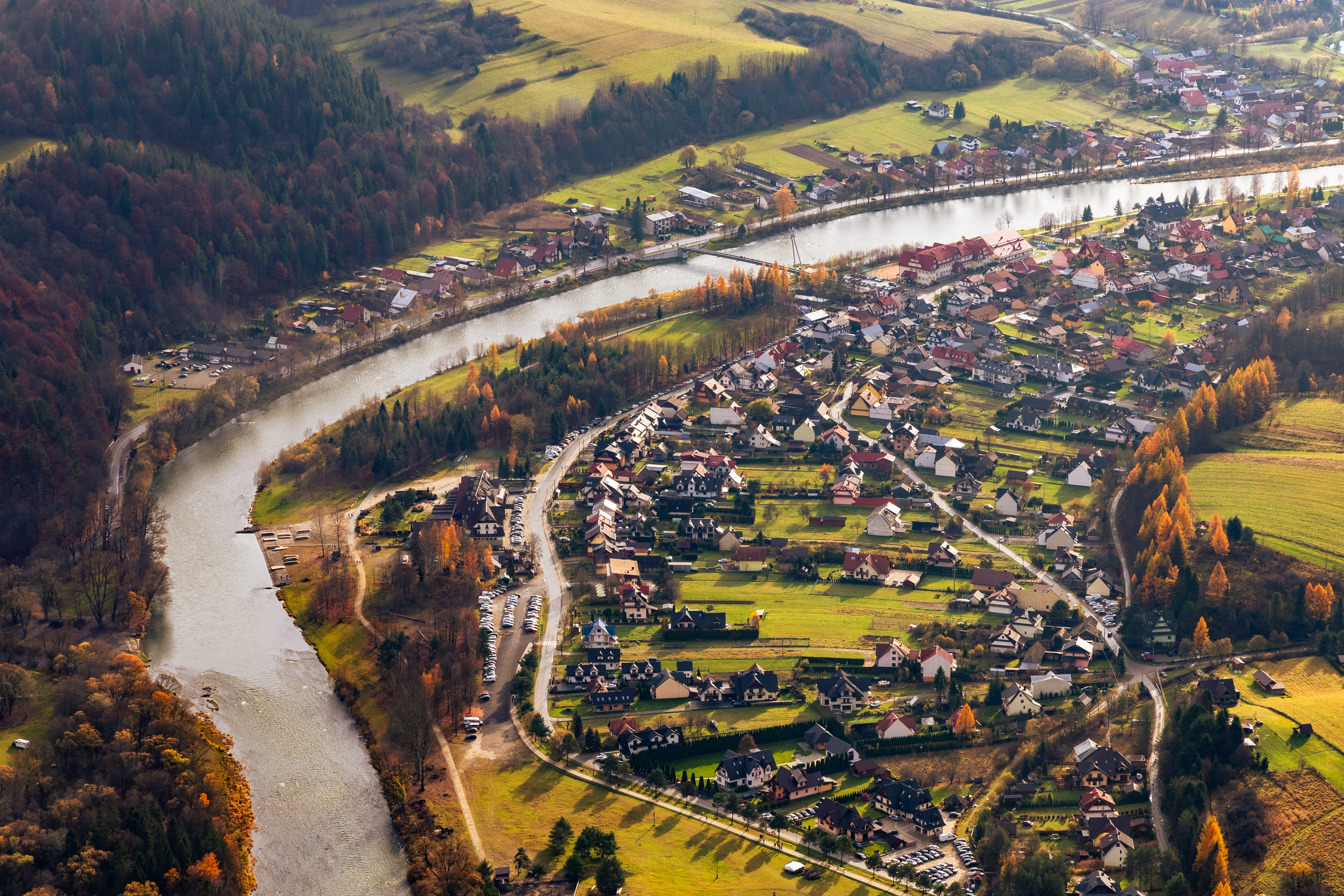 Aerial View of Picturesque Riverside Village in Fall · Free Stock Photo