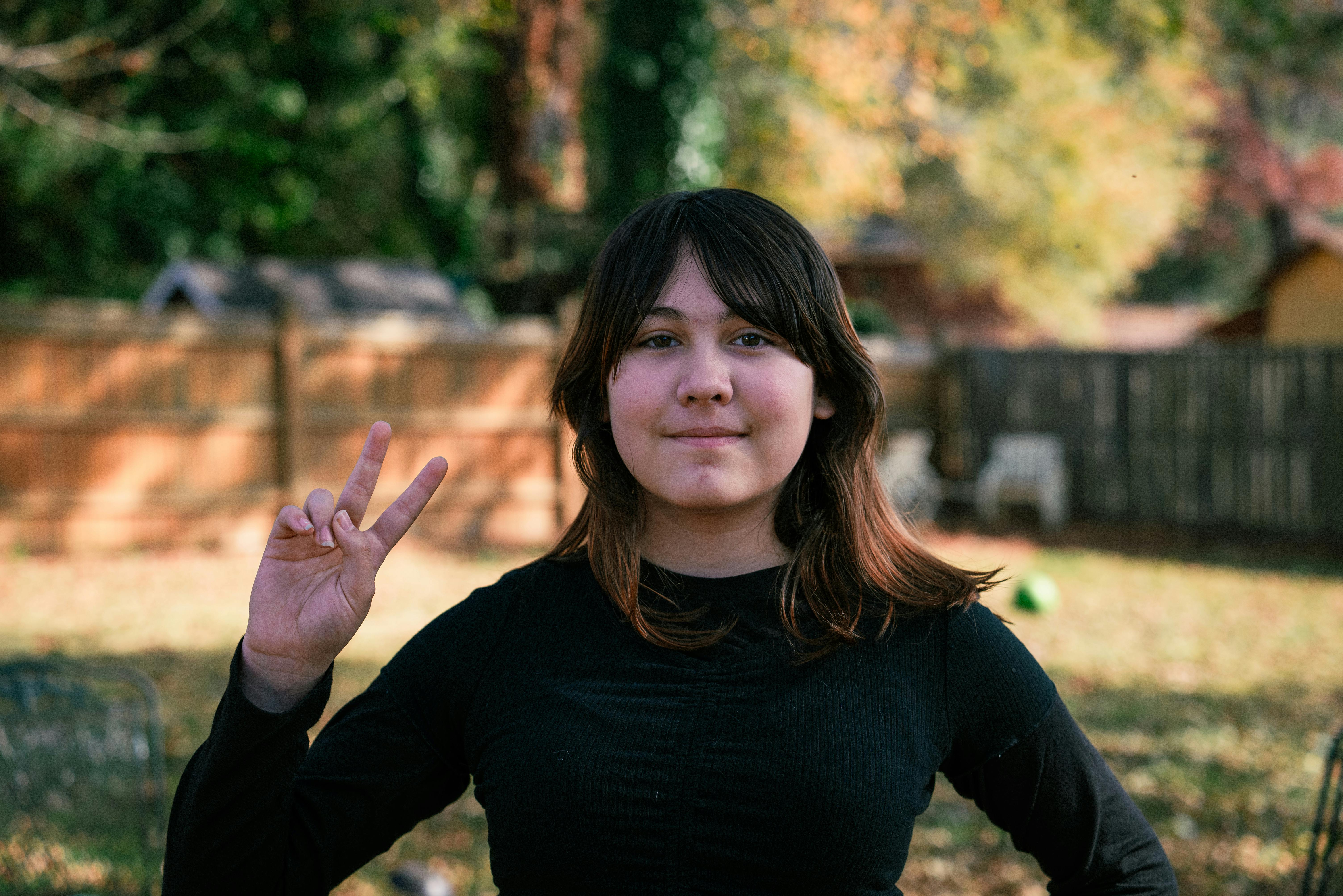 Peaceful Teen in Autumn Backyard Setting · Free Stock Photo