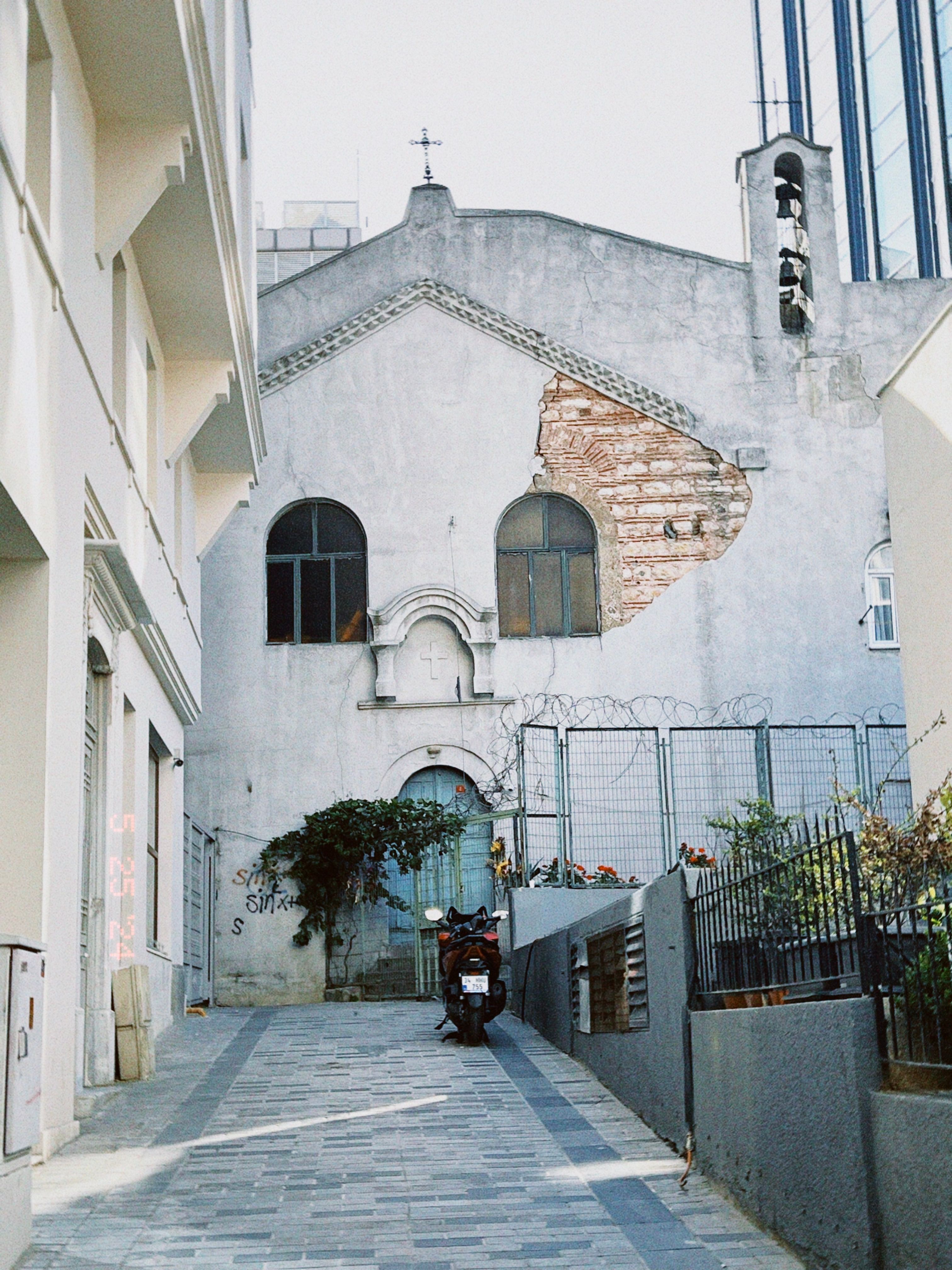 Historic Church Facade in Urban Alleyway · Free Stock Photo