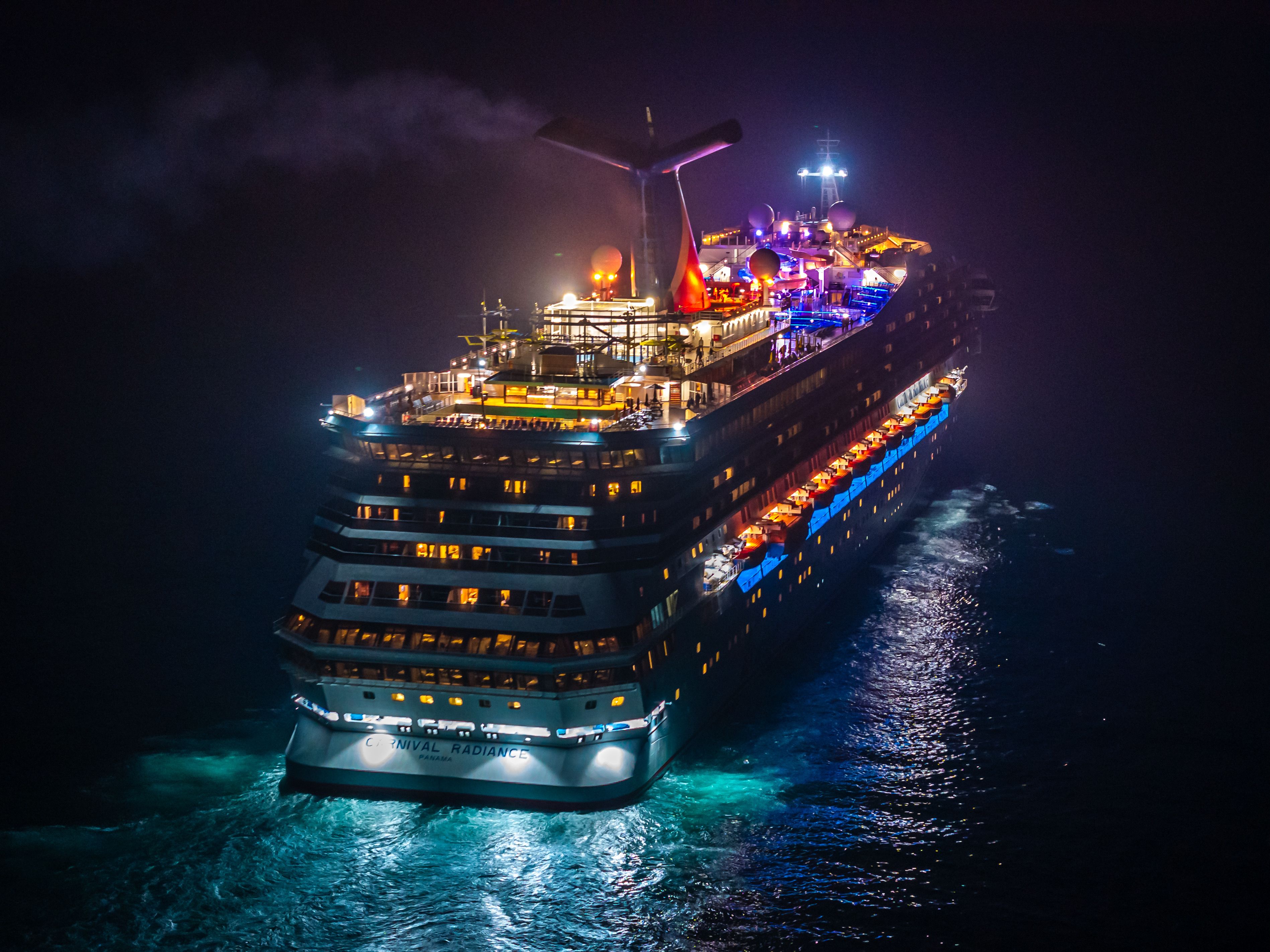 Illuminated Cruise Ship Sailing at Night · Free Stock Photo