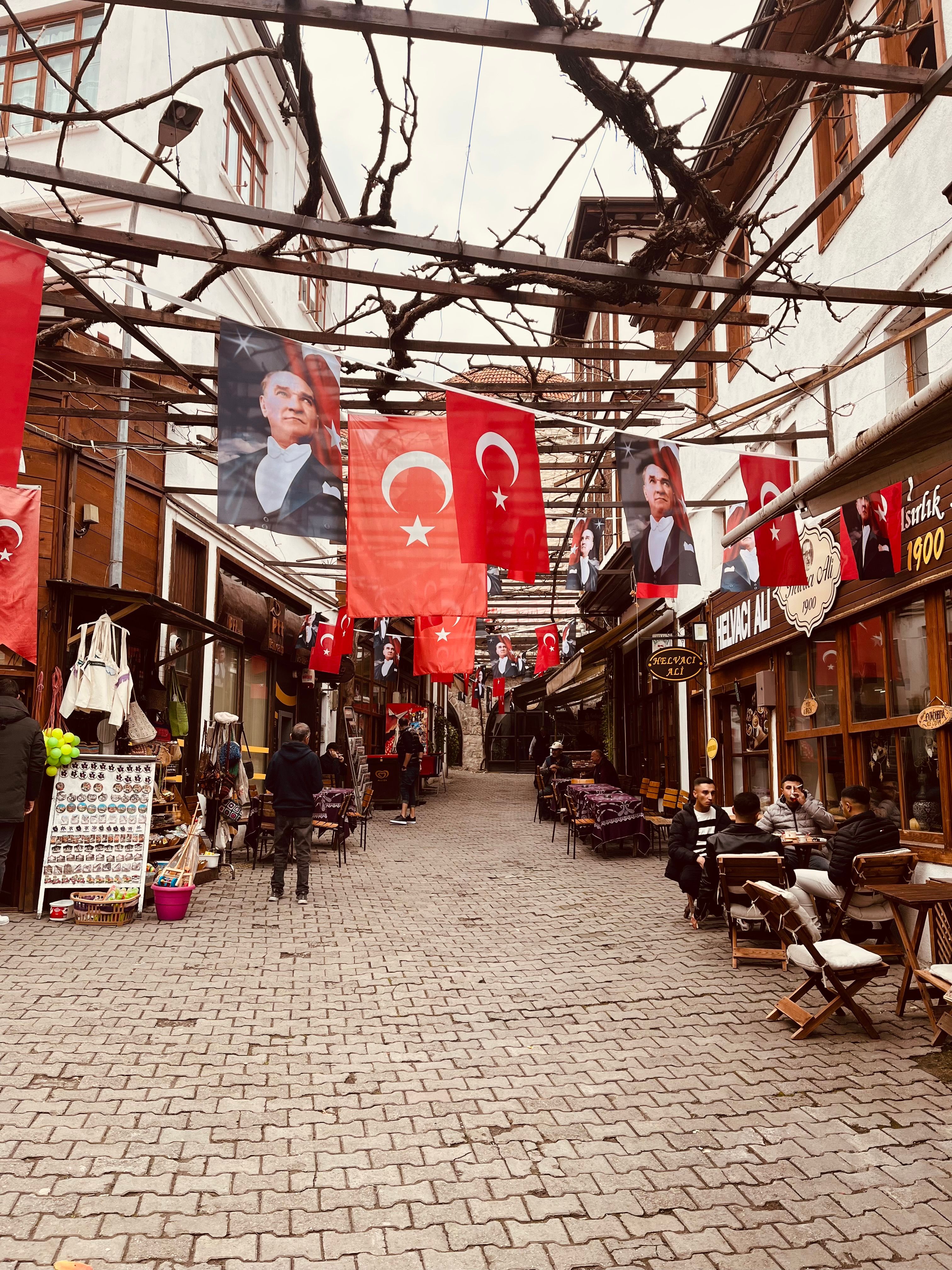 Charming Turkish Street with Flags and Cafes · Free Stock Photo
