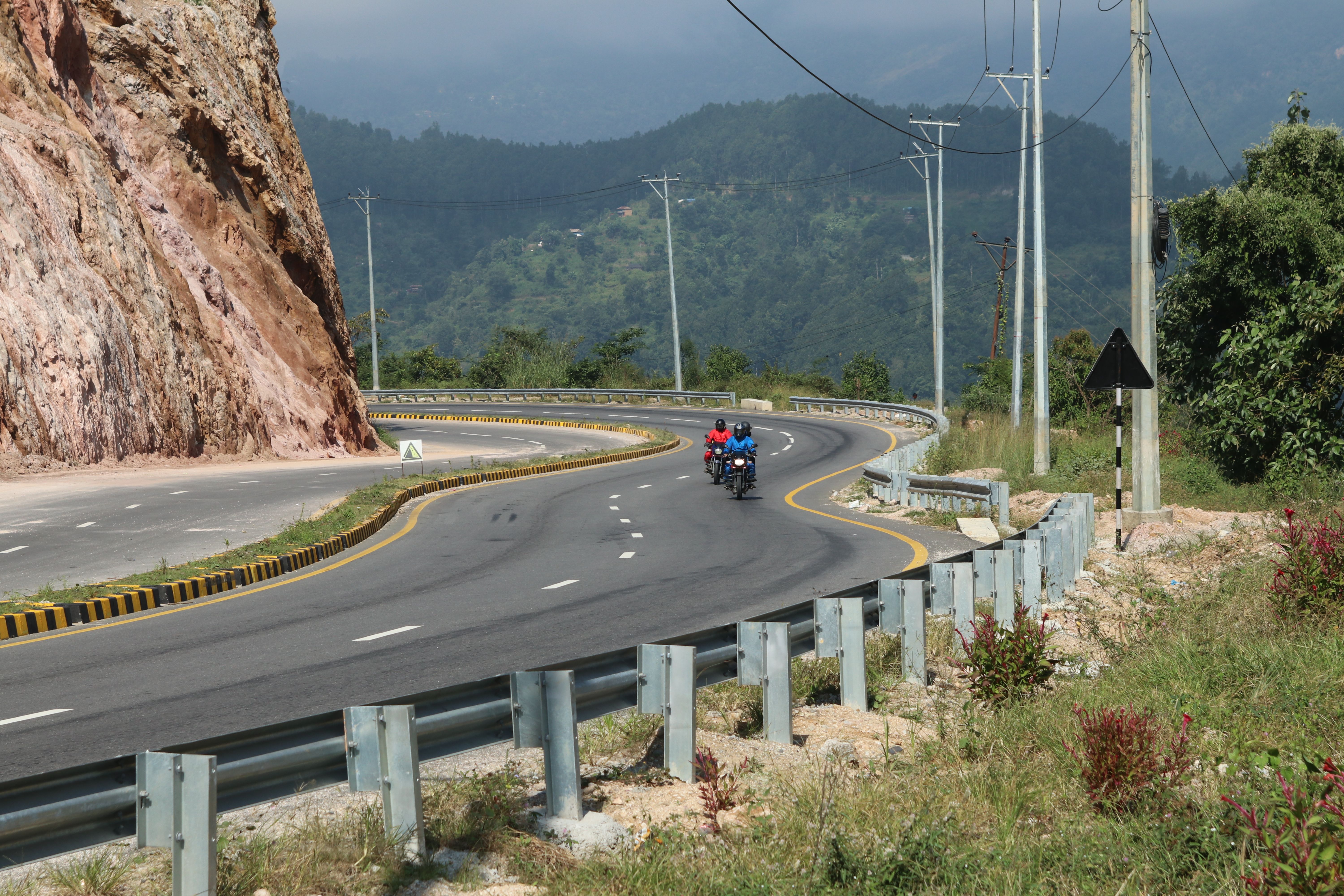 Scenic Motorcycle Ride Through Nepal's Winding Roads · Free Stock Photo