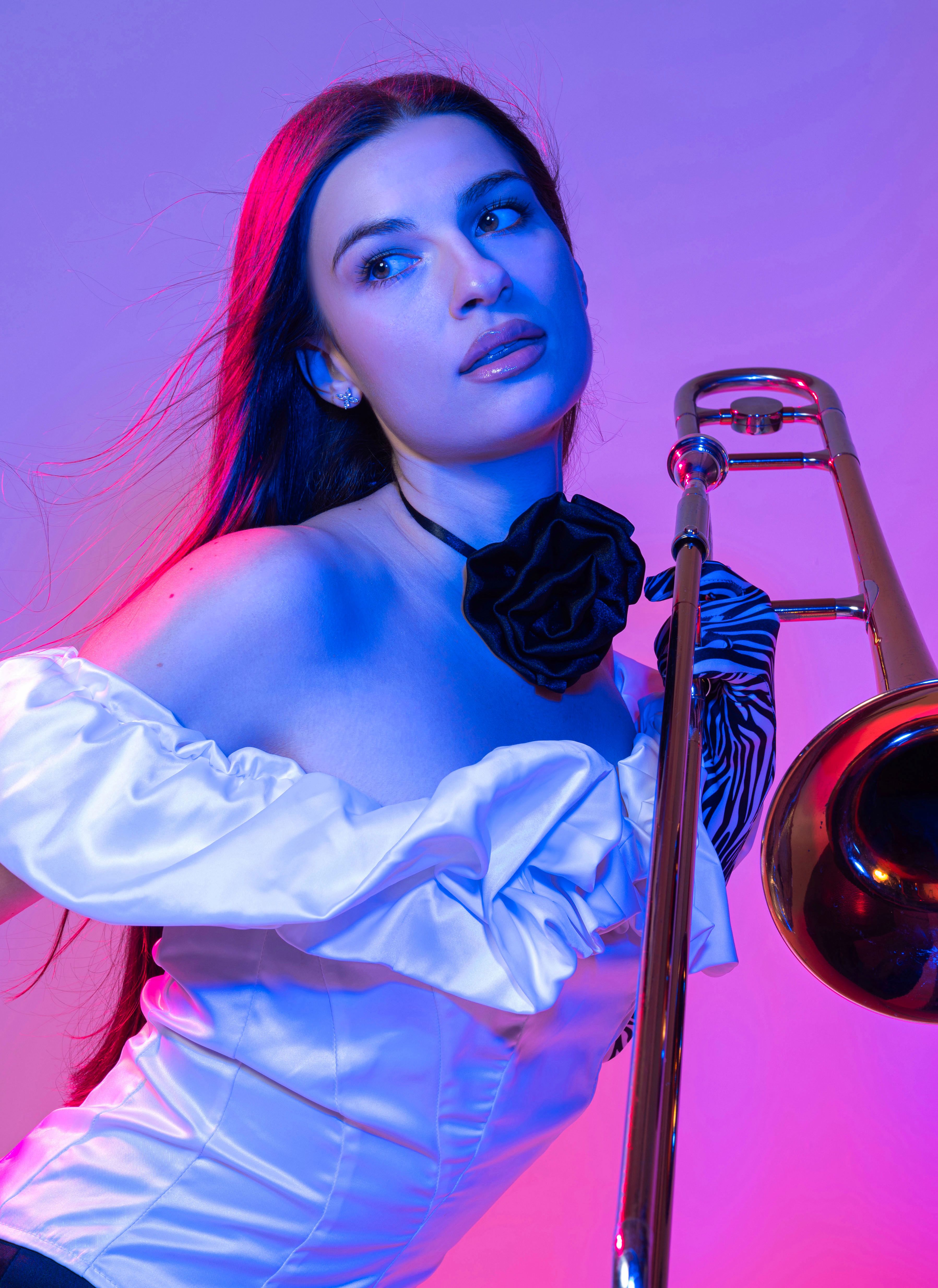 Stylish Musician Posing with Trombone · Free Stock Photo