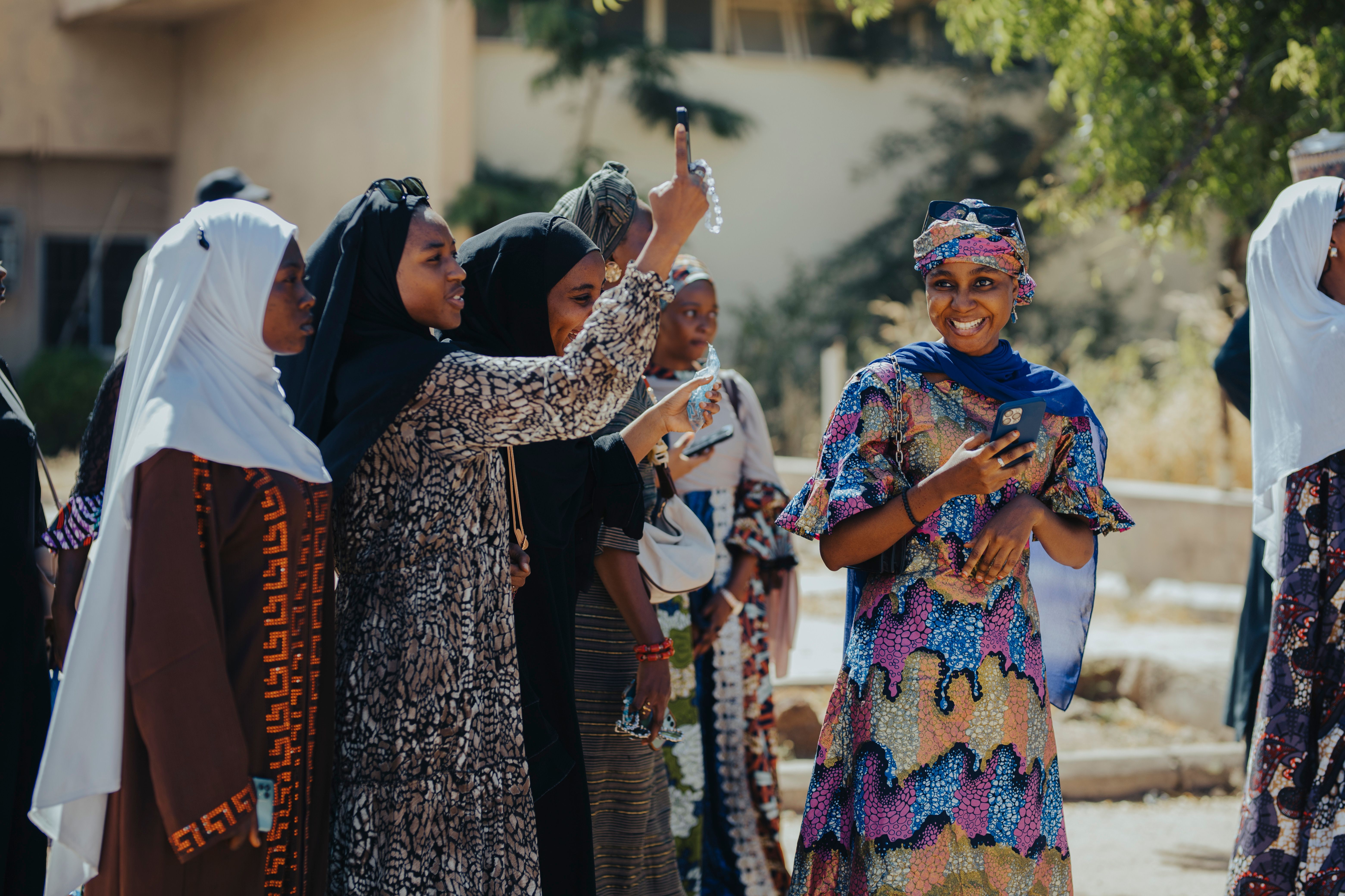 Group of Pilgrims in Saudi Arabian Street Gathering · Free Stock Photo