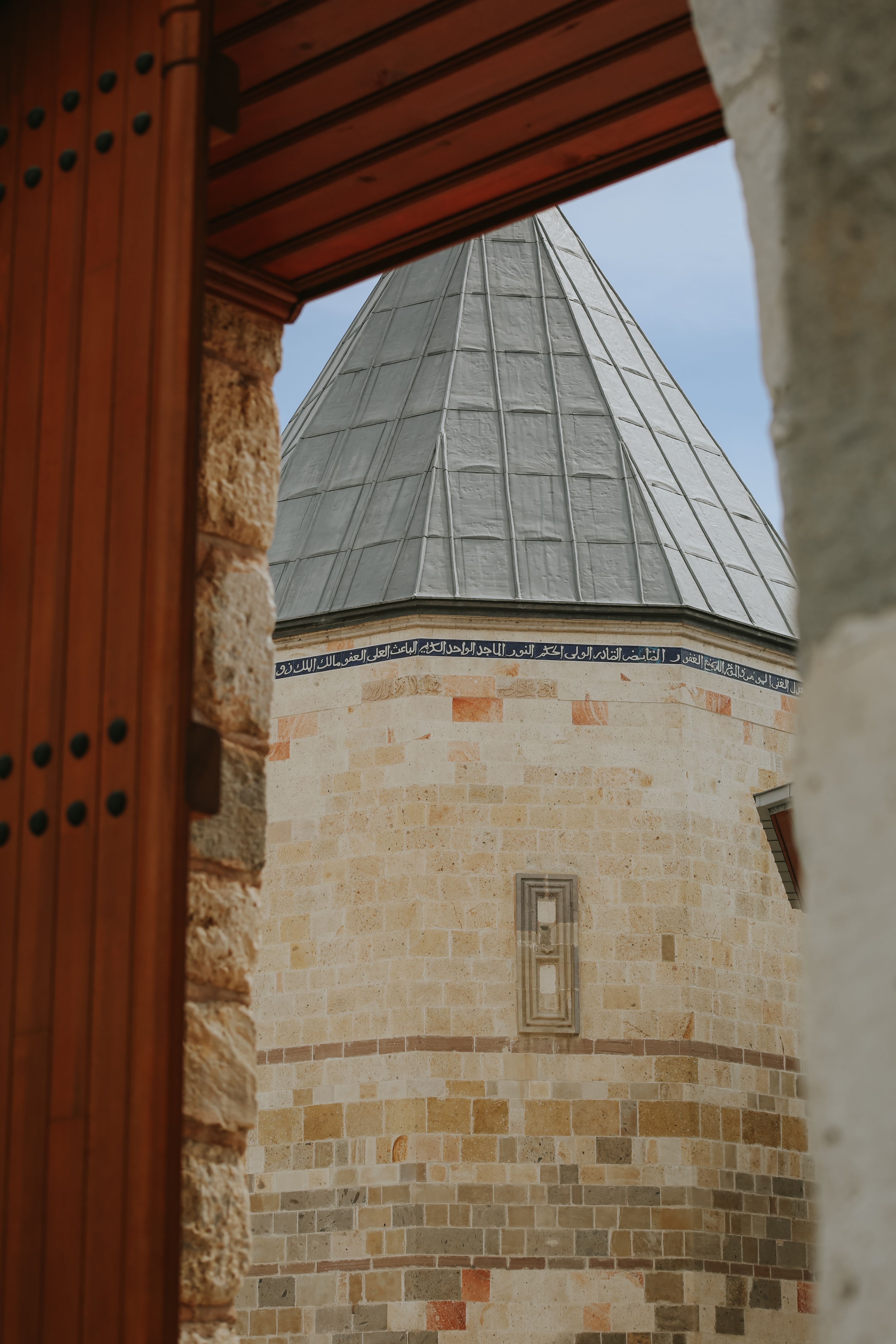 Historic Stone Tower Viewed Through Wooden Doorway · Free Stock Photo