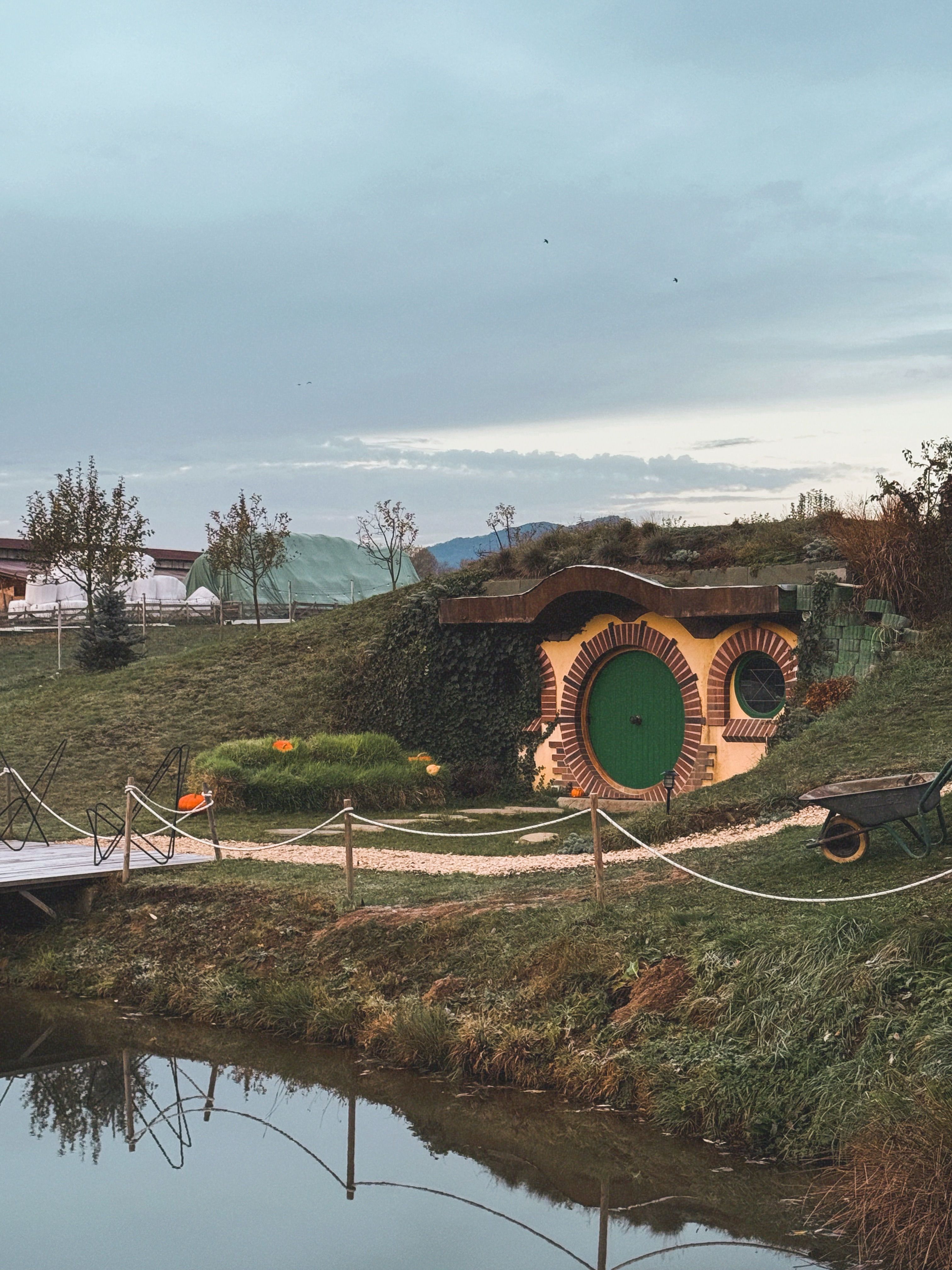 Hobbit House Landscape with Reflection Pond · Free Stock Photo