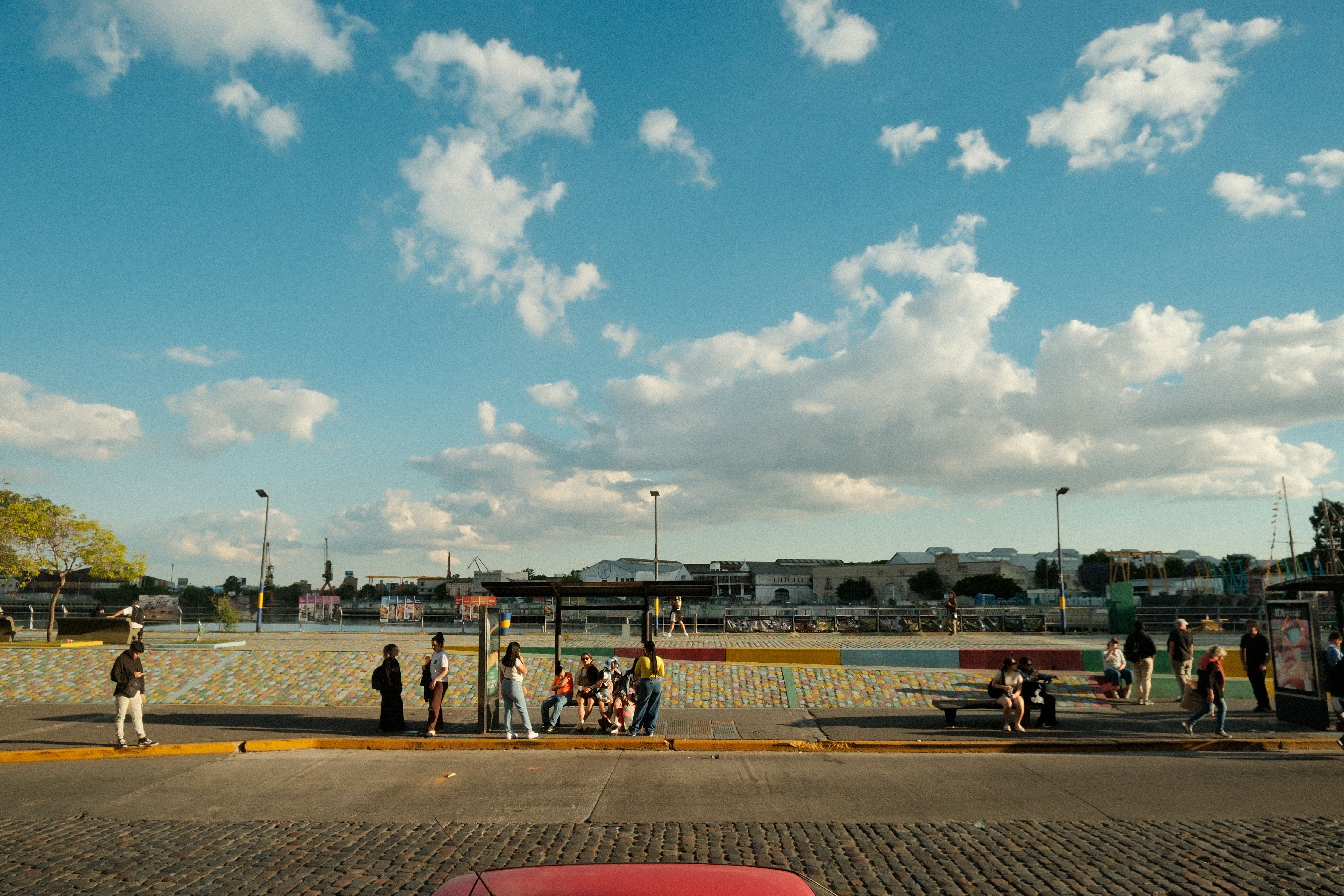 Street Scene with Colorful Pavement Under Blue Sky · Free Stock Photo