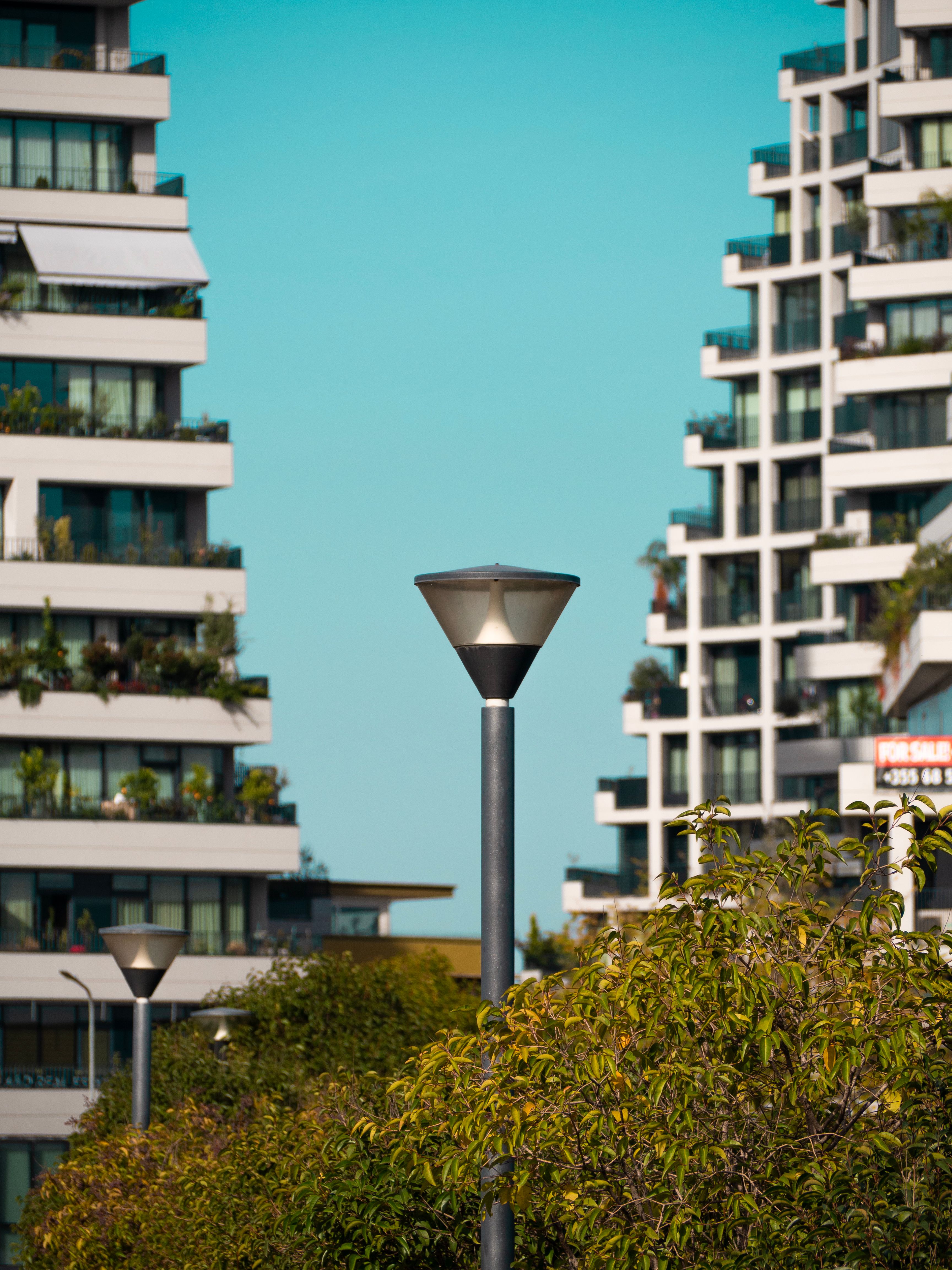 Modern Apartment Buildings with Street Lamps · Free Stock Photo