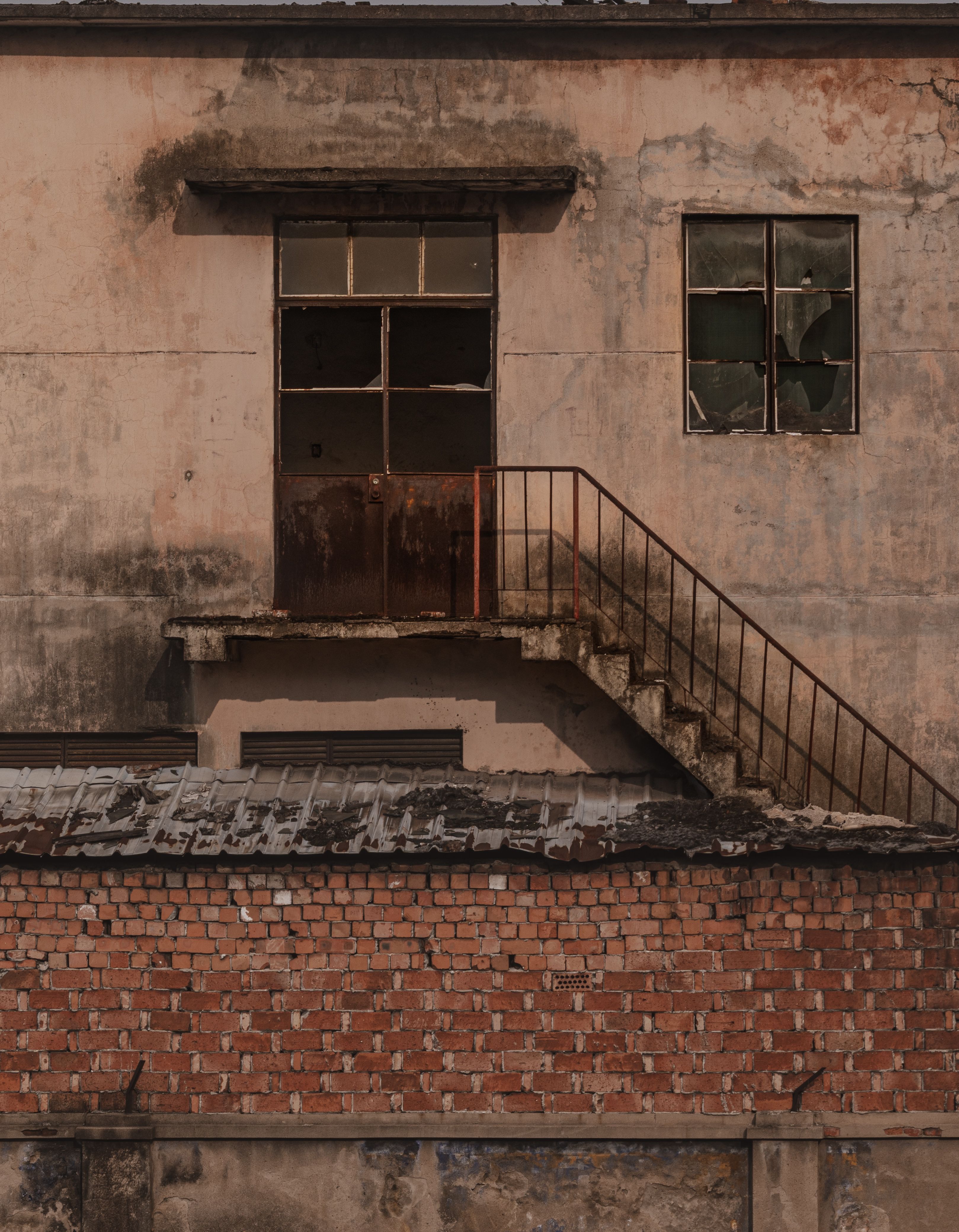 Rustic Industrial Building Exterior with Stairs · Free Stock Photo