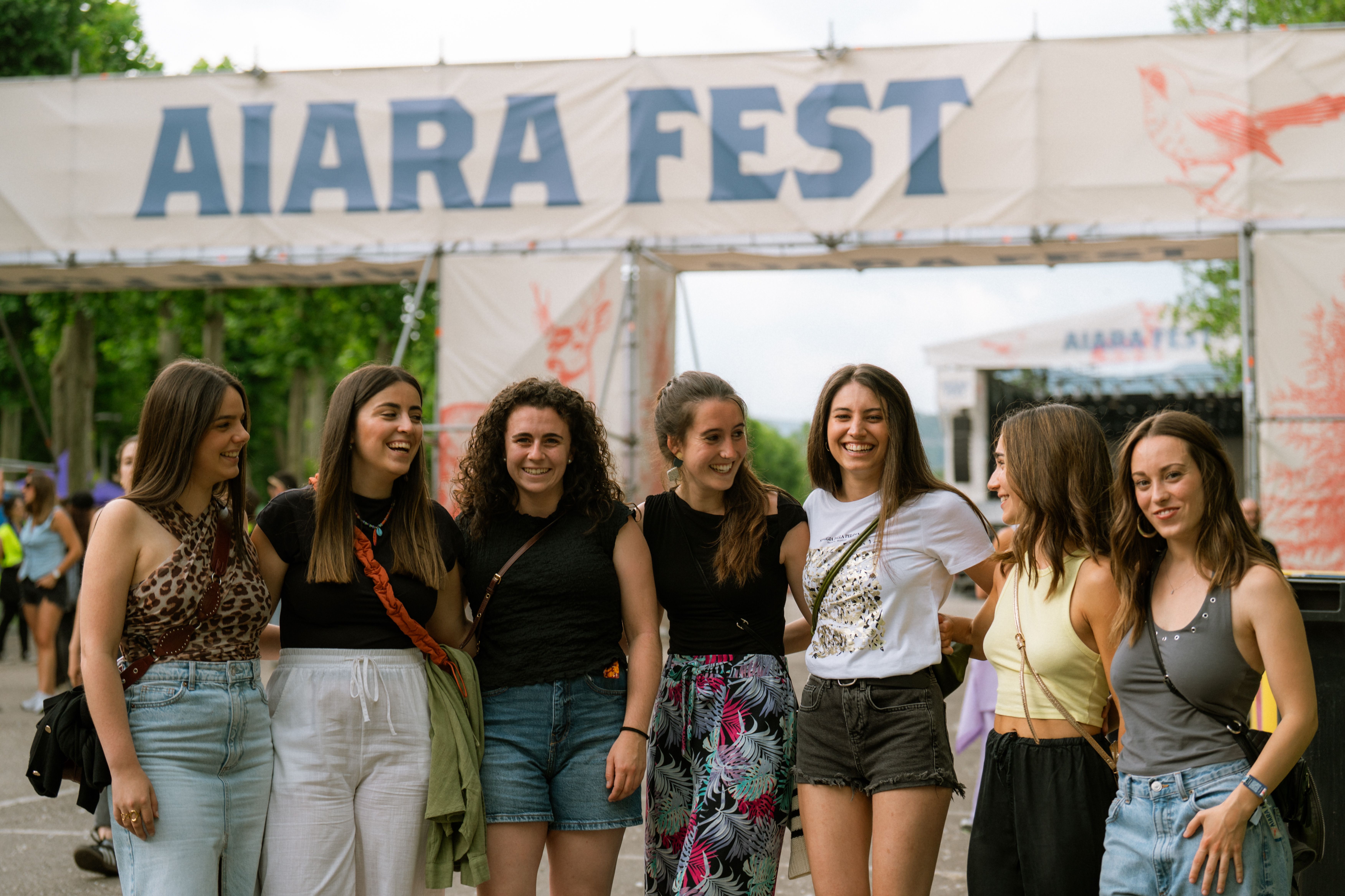 Group of Friends Enjoying AIARA Fest Entrance · Free Stock Photo