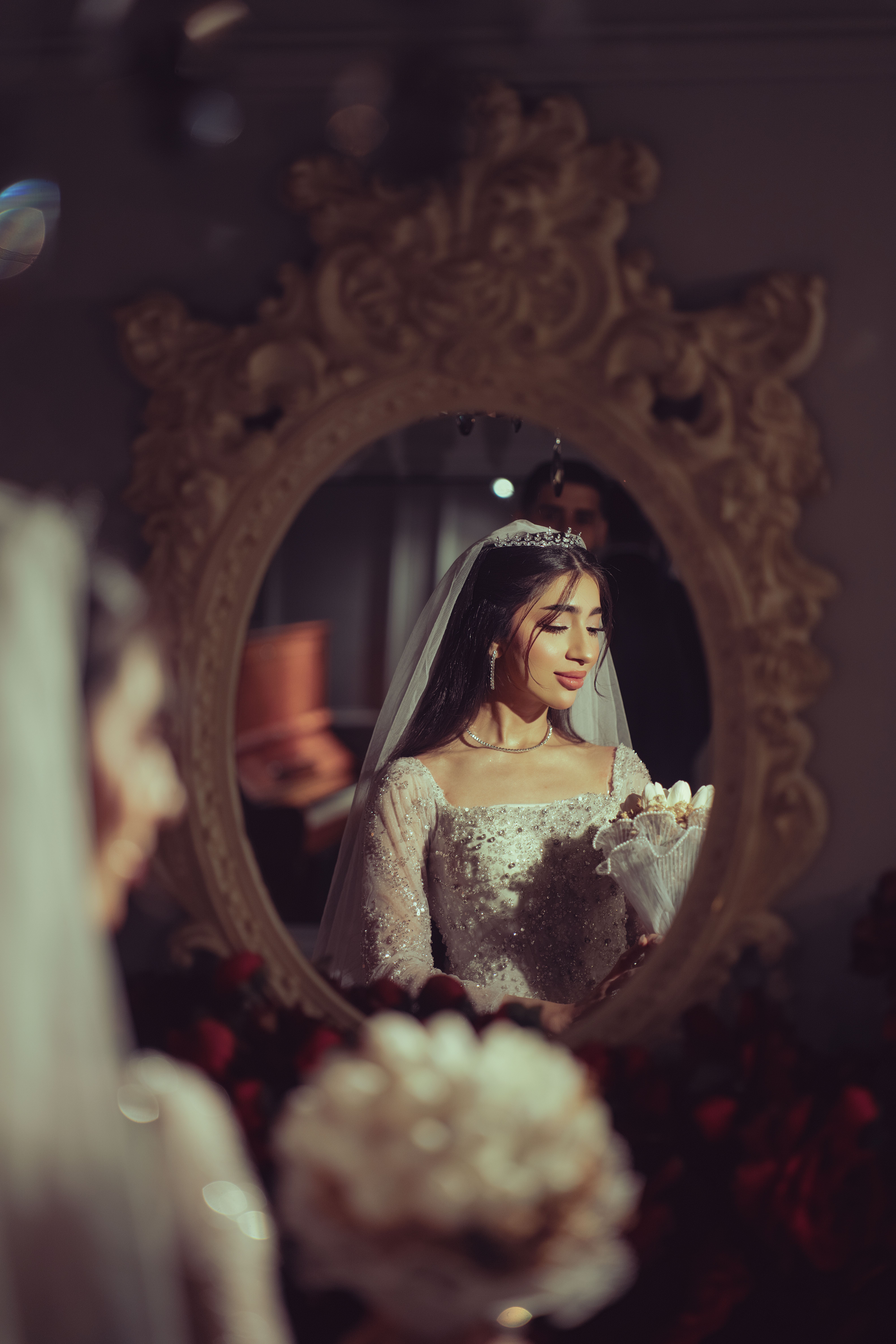 Elegant Bride Gazing in Ornate Mirror · Free Stock Photo