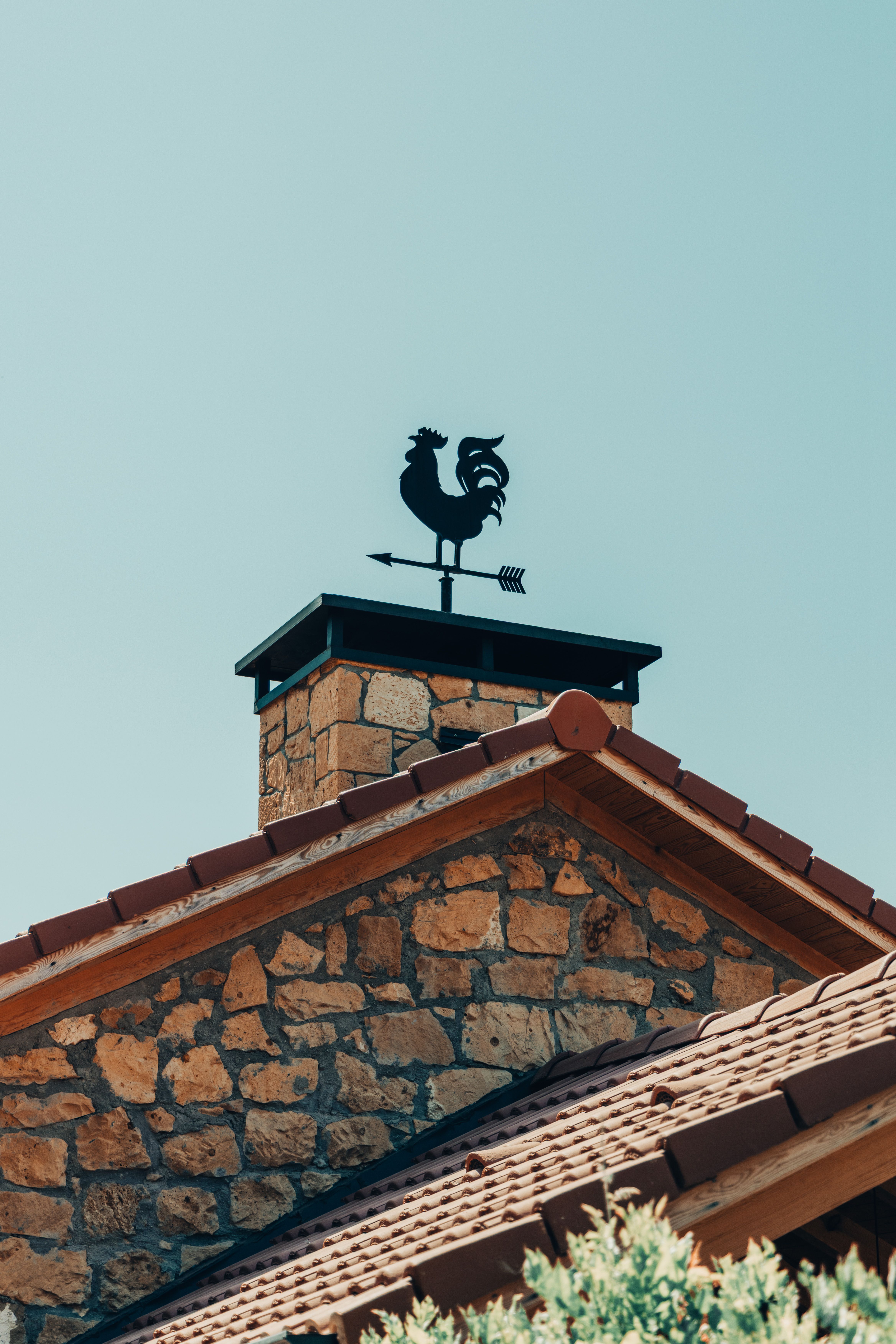 Rustic Stone Cottage with Weather Vane · Free Stock Photo