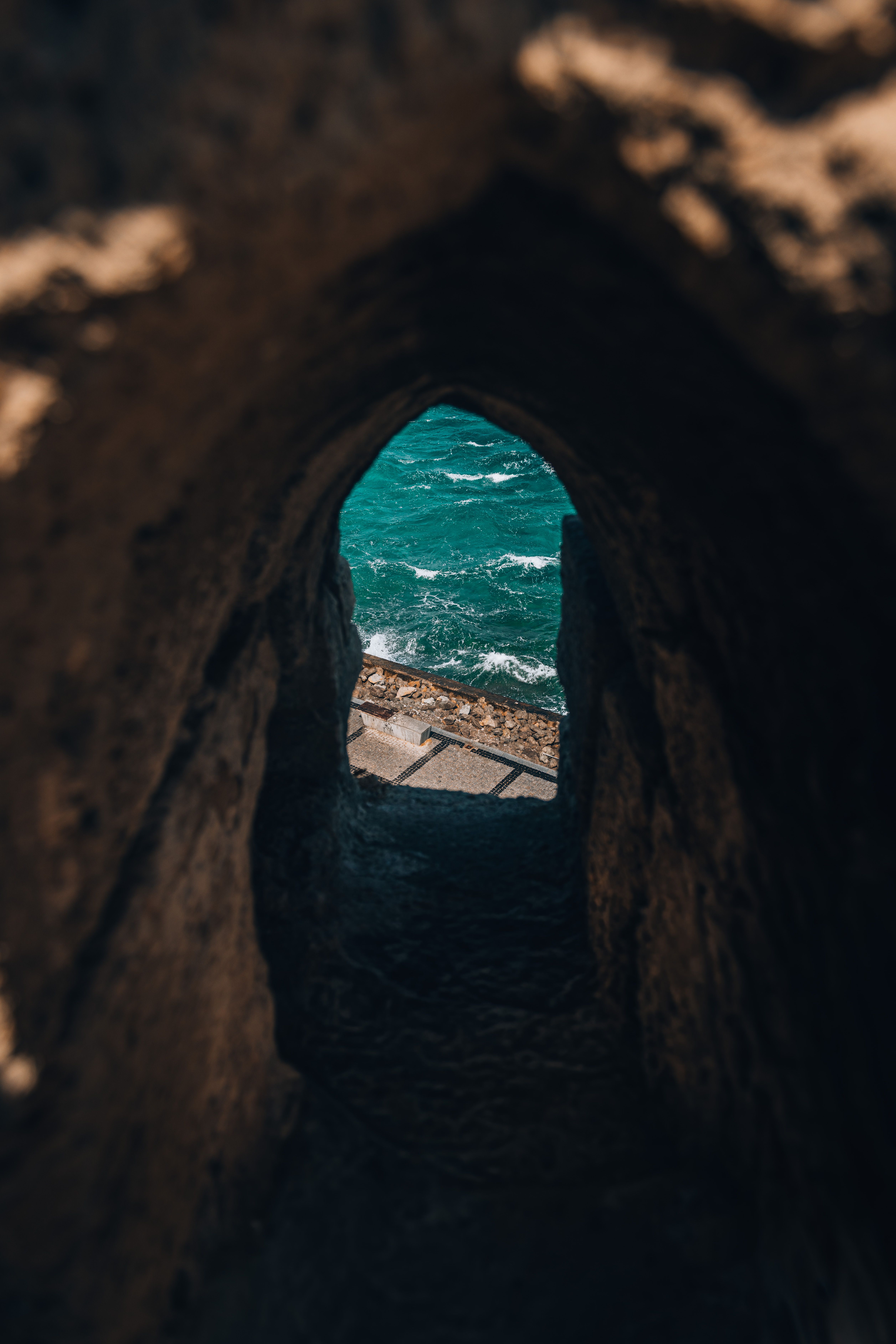 Gray Cave Near Body of Water · Free Stock Photo