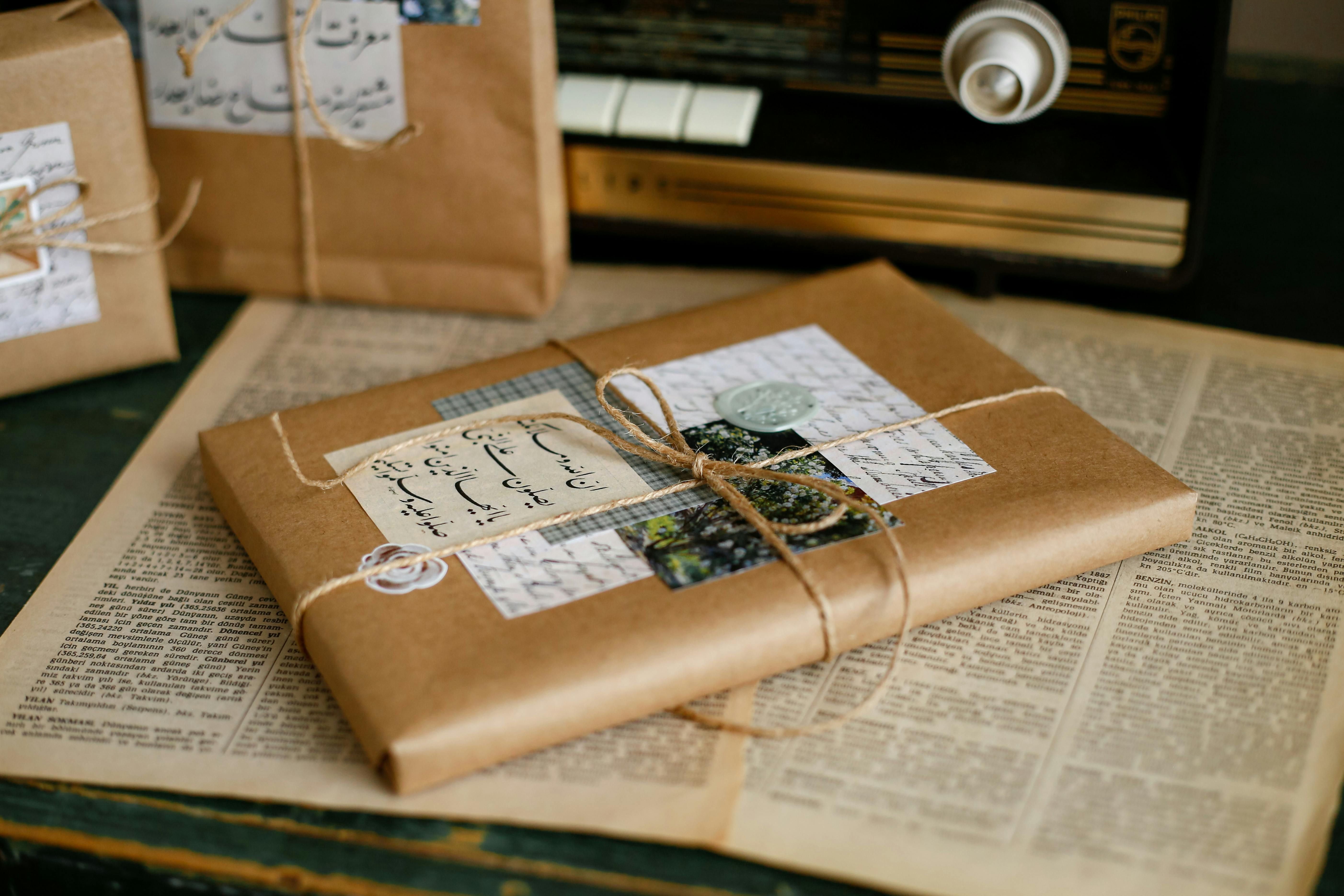 Vintage Gift Wrapping on Antique Book Background · Free Stock Photo