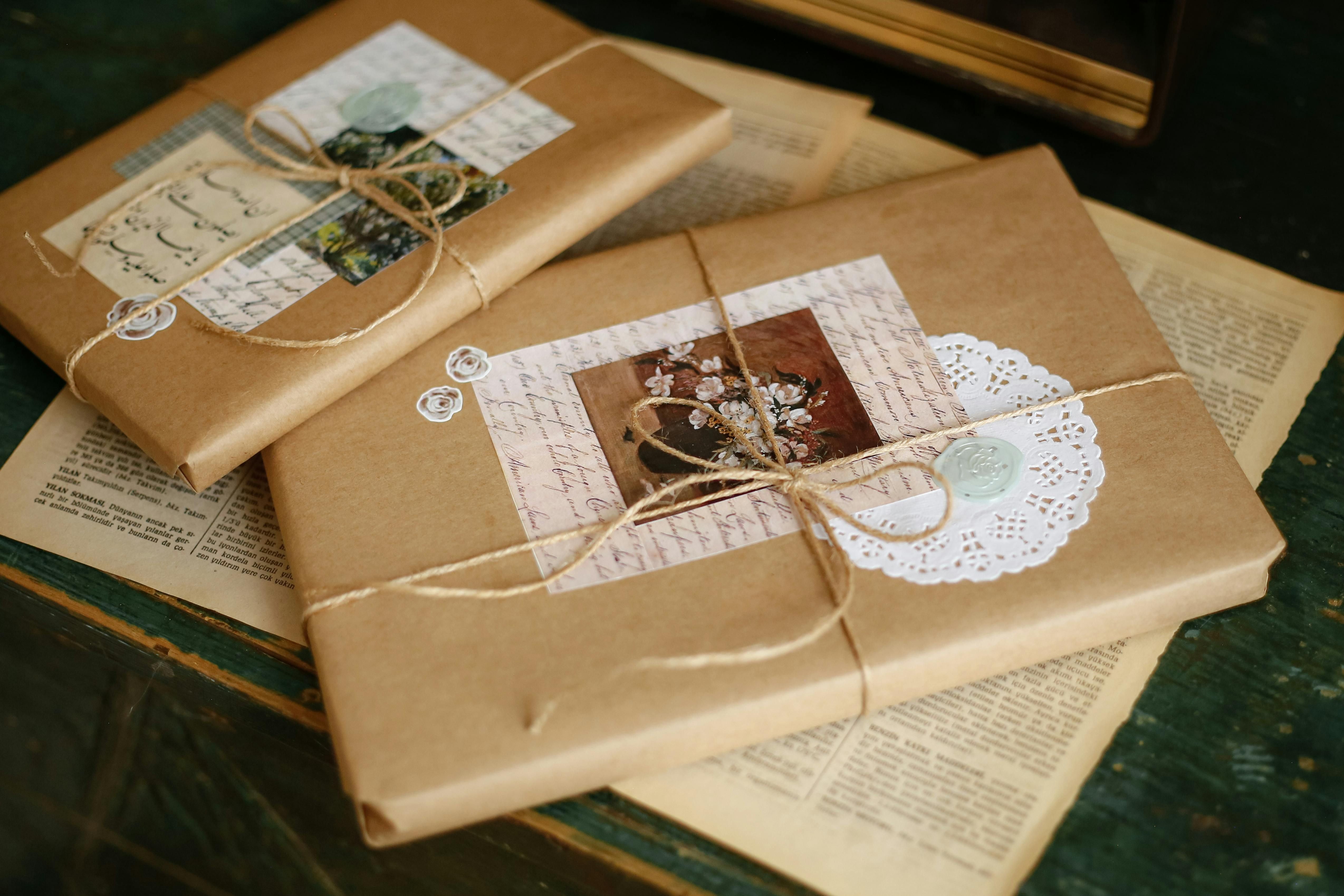 Vintage Styled Wrapped Gift Packages on Table · Free Stock Photo