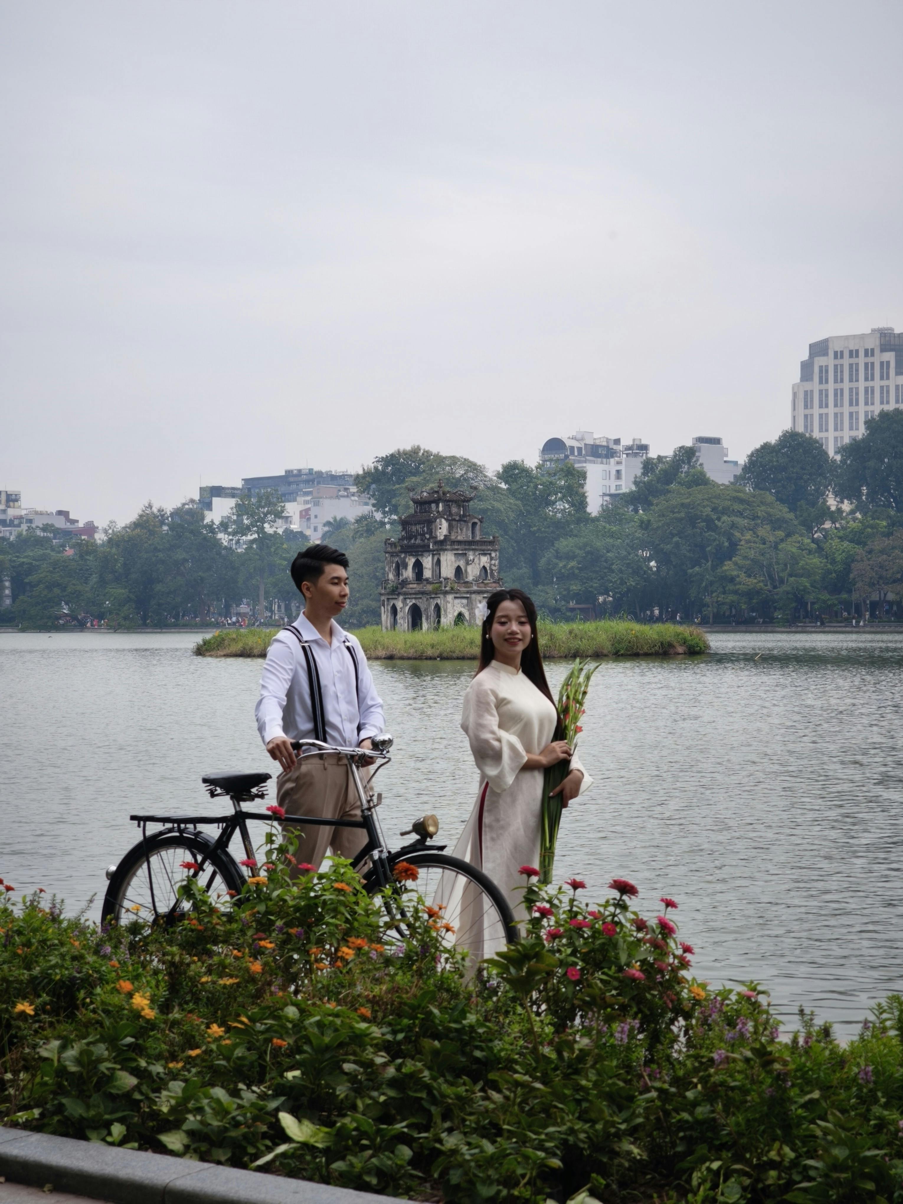 Couple by Hoan Kiem Lake in Hanoi, Vietnam · Free Stock Photo