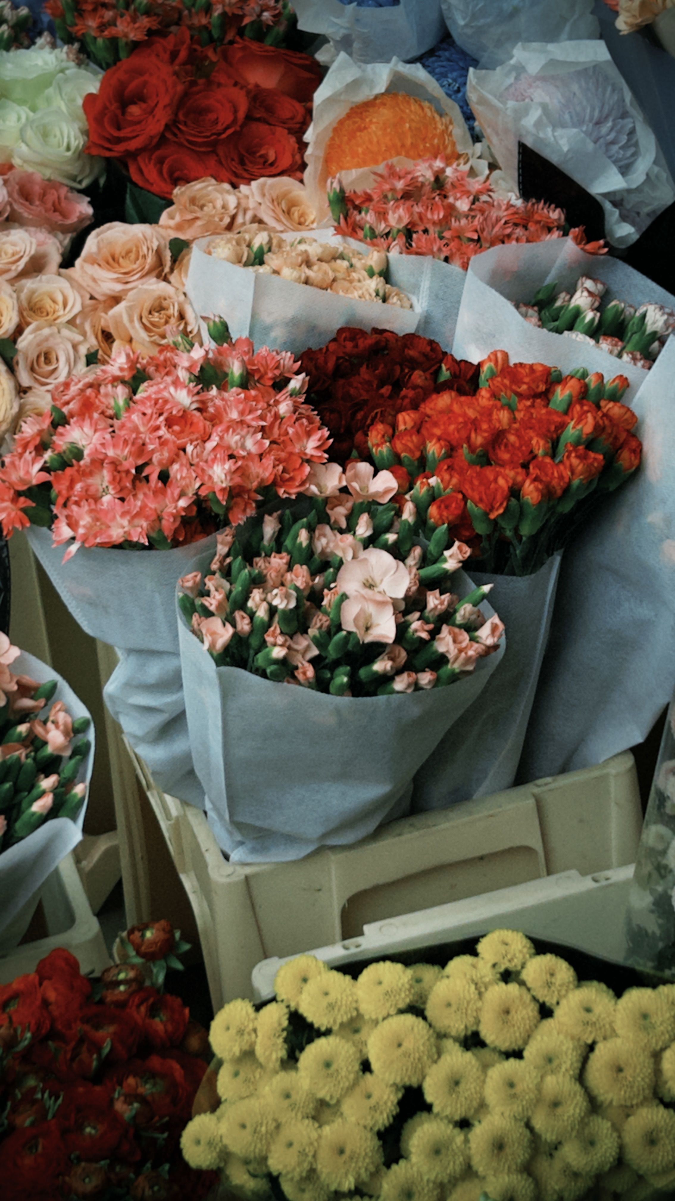 Vibrant Floral Bouquets at a Market Display · Free Stock Photo