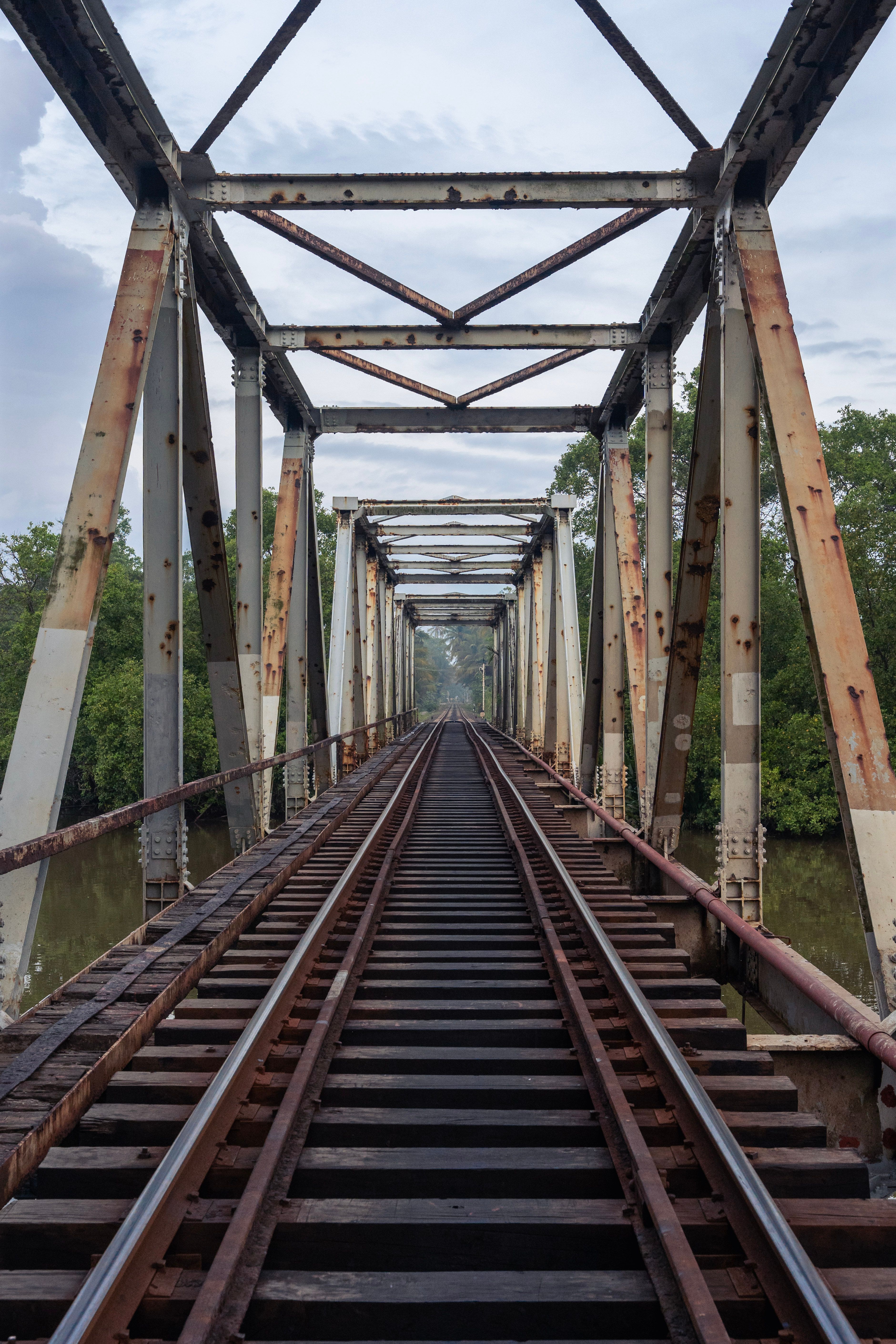 Rustic Steel Railway Bridge Over River · Free Stock Photo