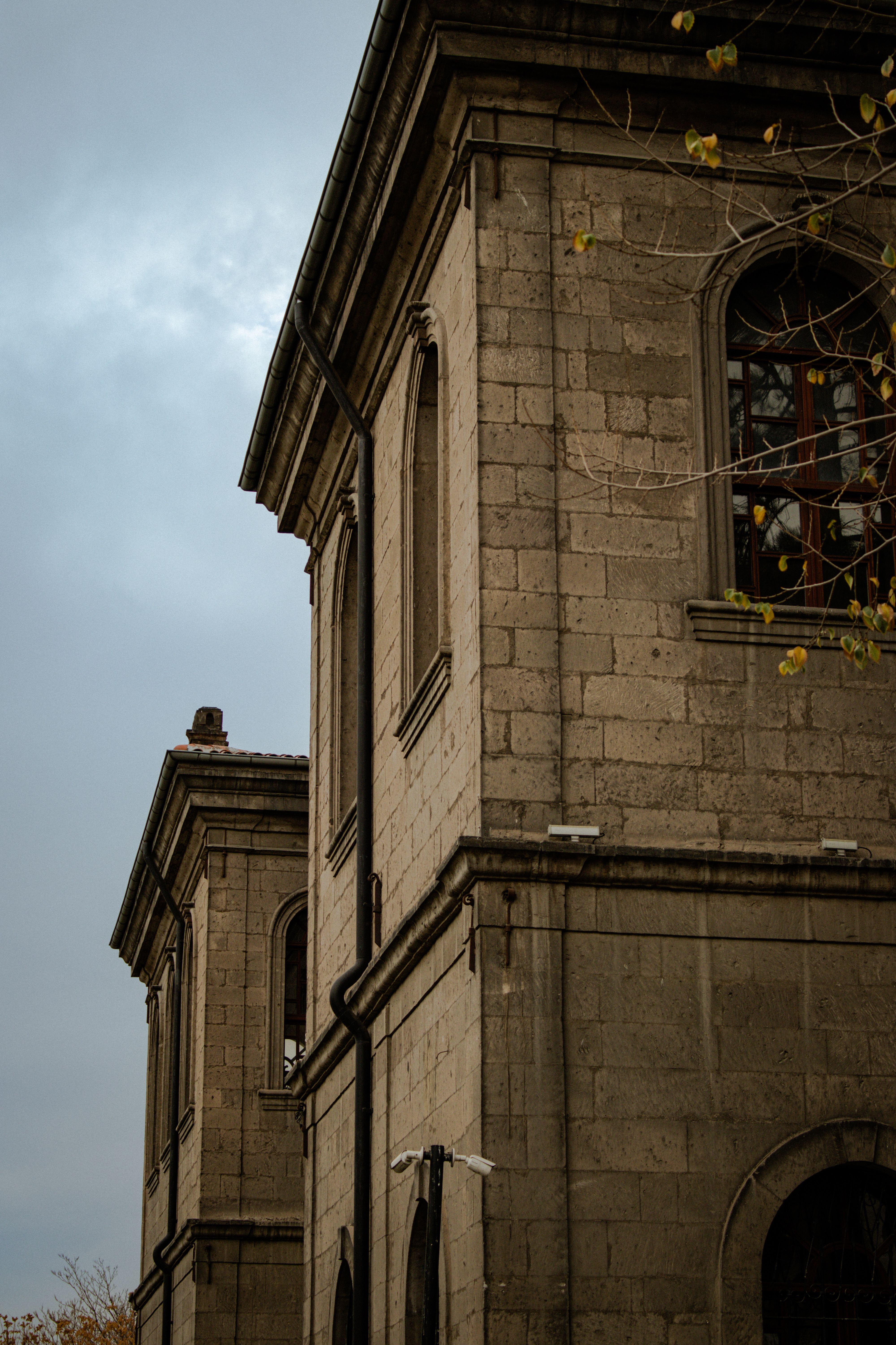 Historic Stone Building with Arched Windows · Free Stock Photo