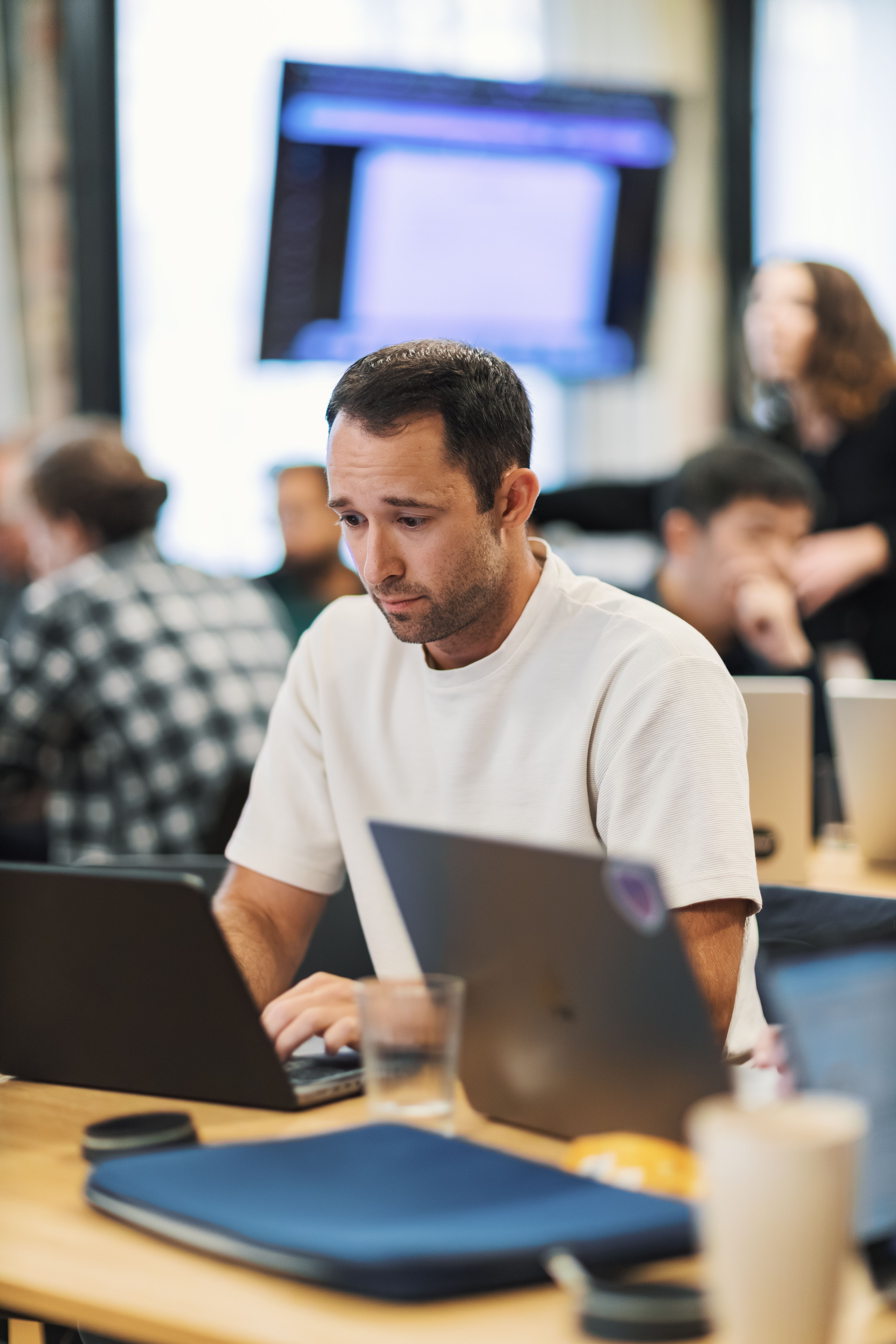 Professional Team Working in Office Space · Free Stock Photo