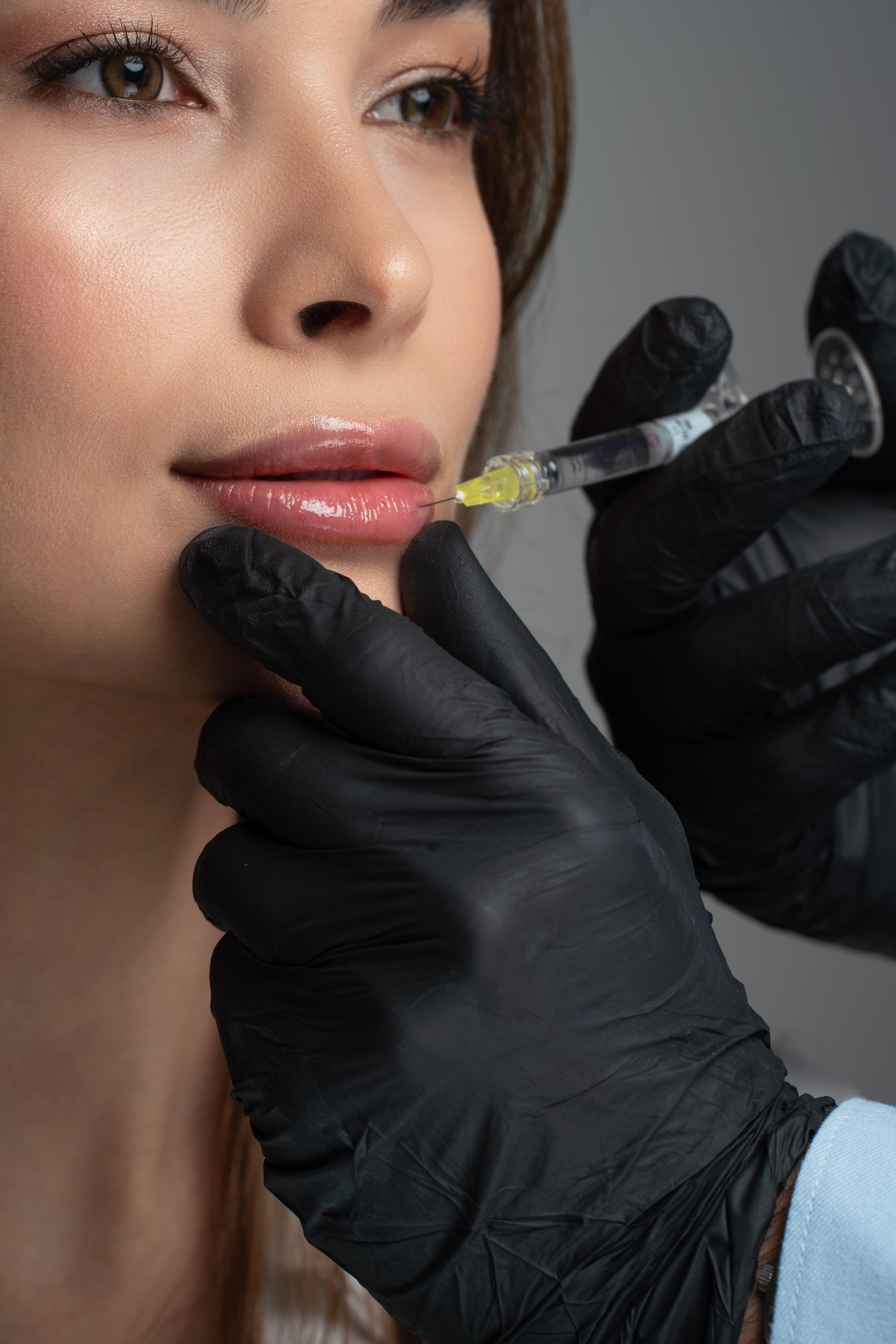 Close-up of Cosmetic Lip Injection Procedure · Free Stock Photo