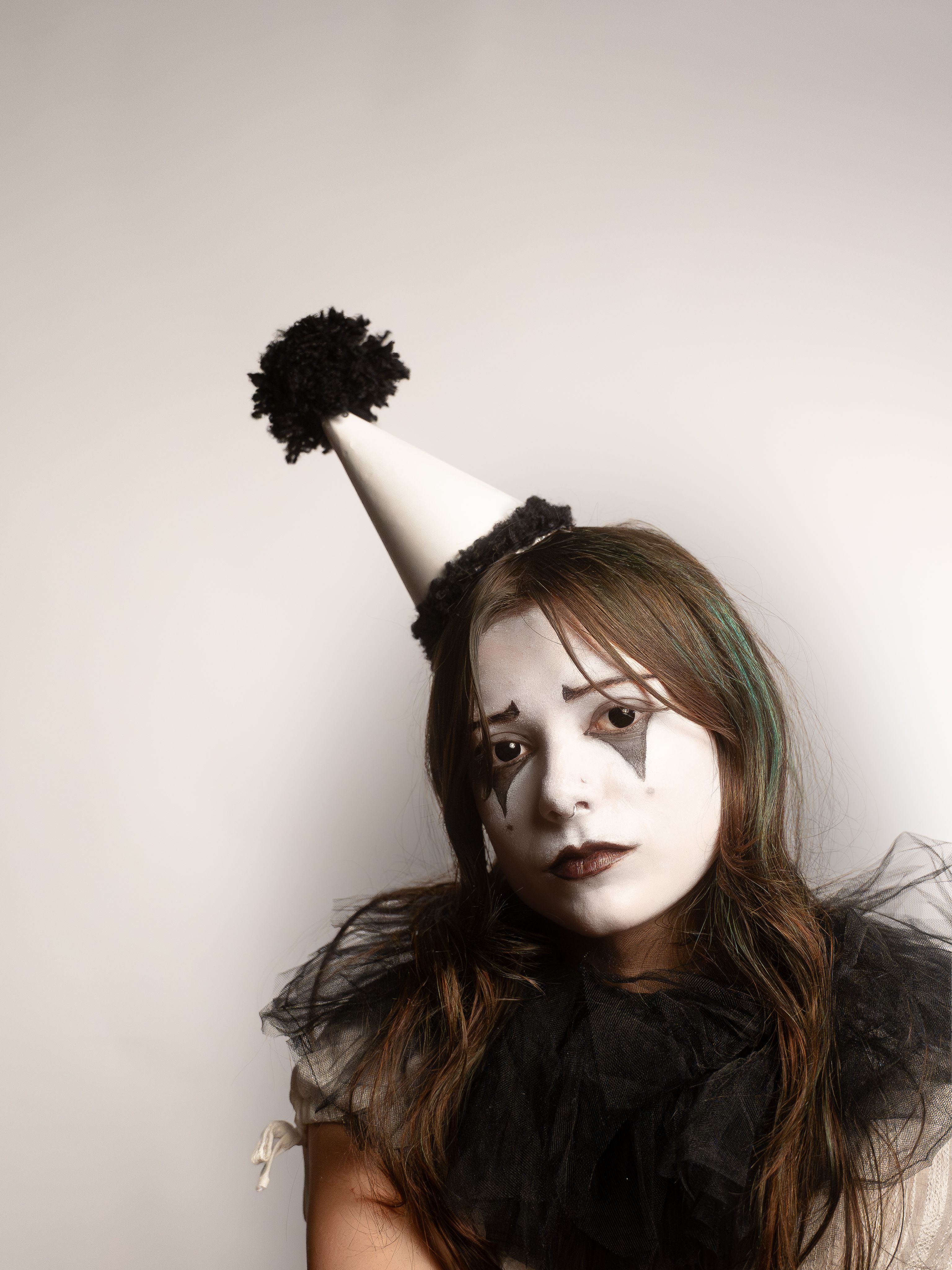 Dramatic Portrait of Child in Clown Costume · Free Stock Photo