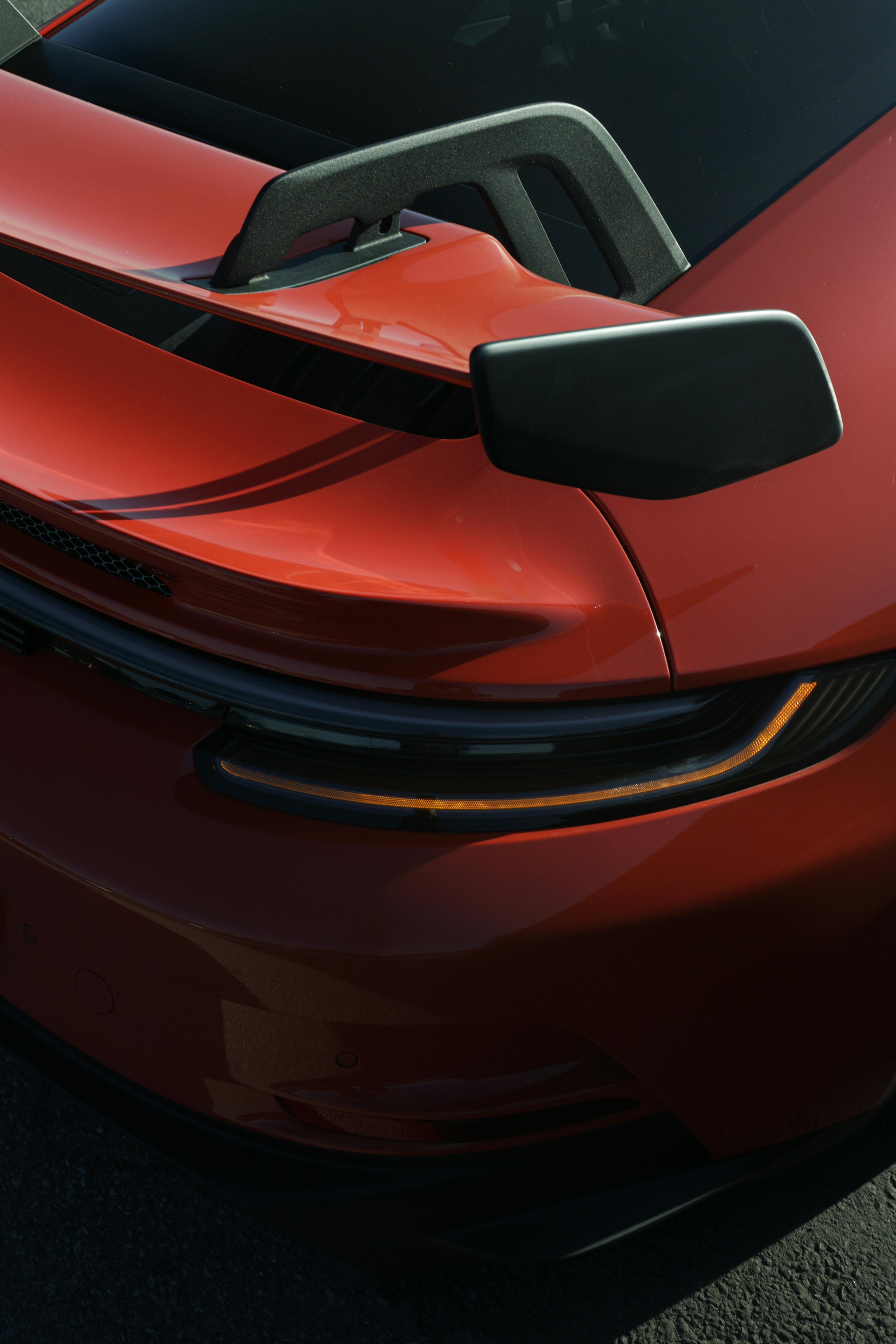 Close-up of Red Sports Car Tail Light Detail · Free Stock Photo