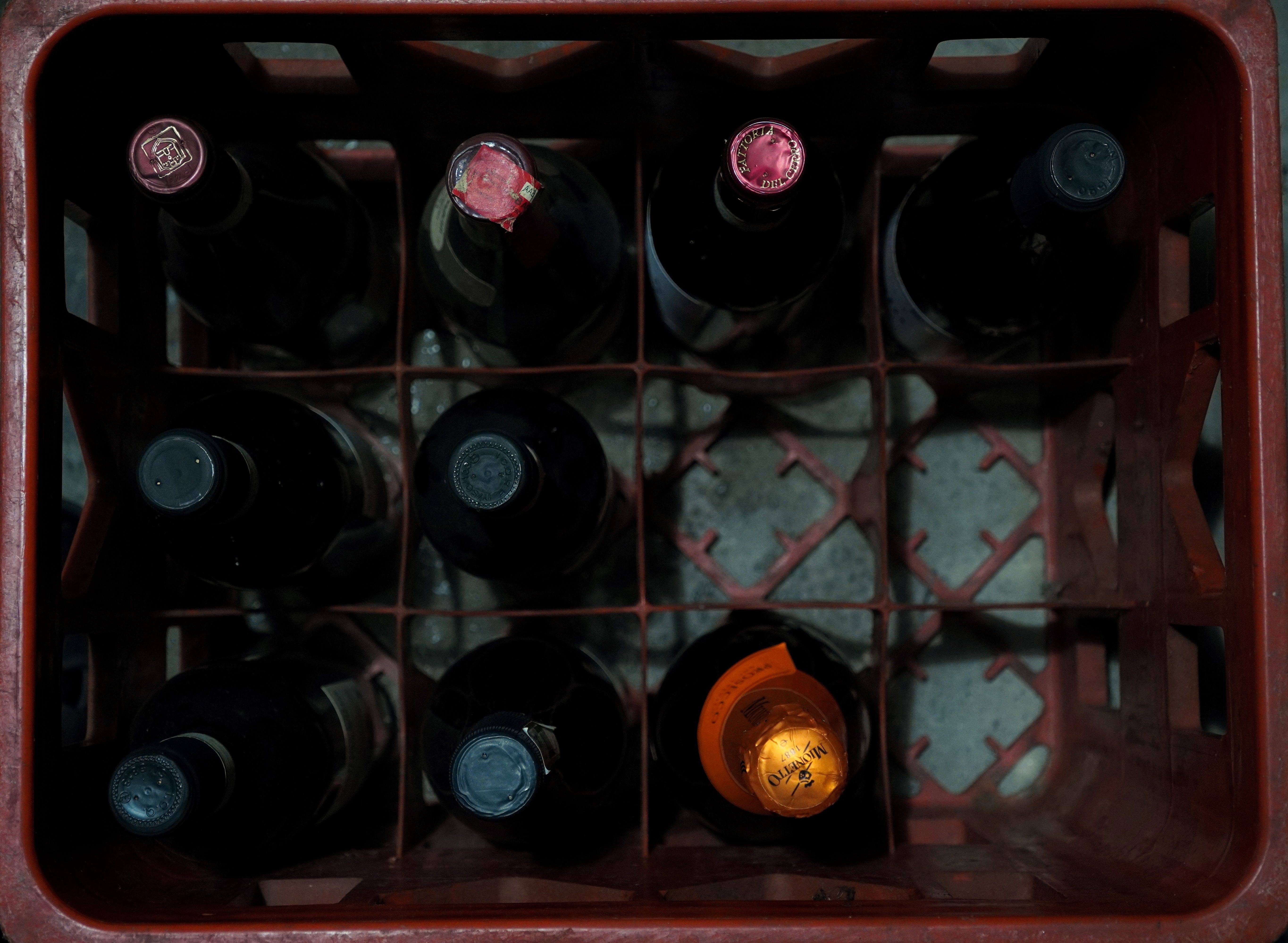 Top view of wine bottles in a storage crate · Free Stock Photo