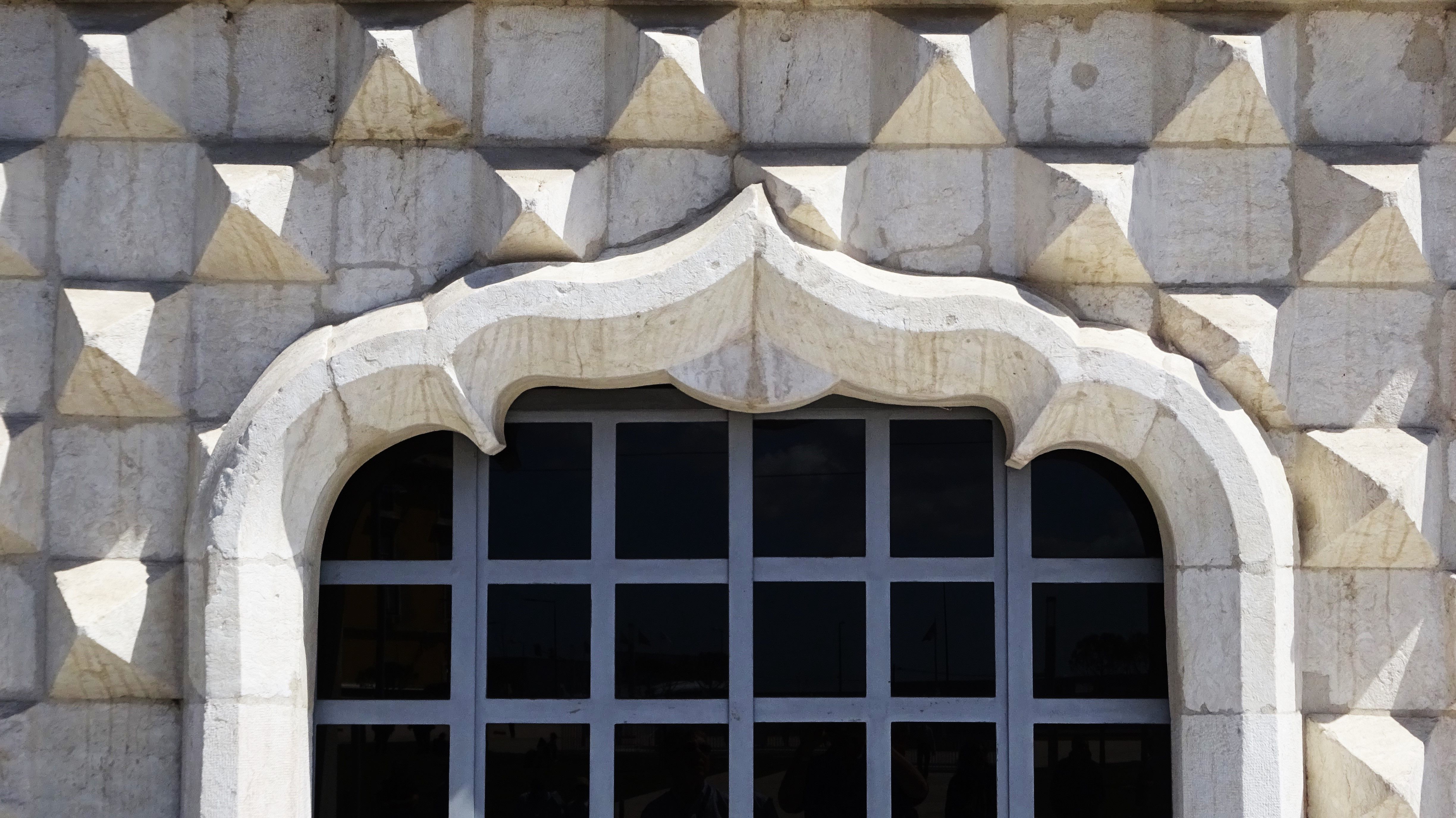 Ornate Architectural Window with Shadow Play · Free Stock Photo