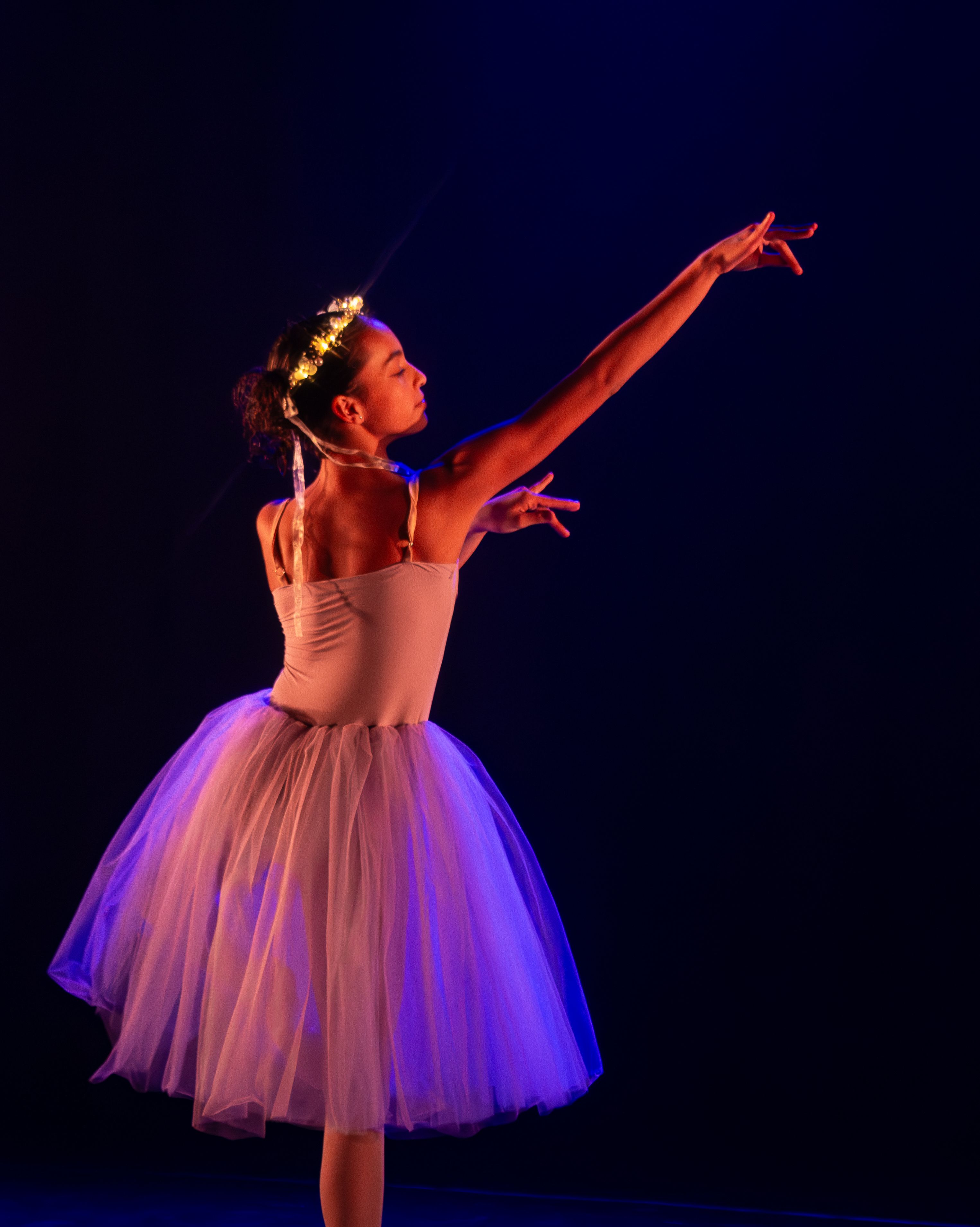 Elegant Ballerina Posing Gracefully on Stage · Free Stock Photo