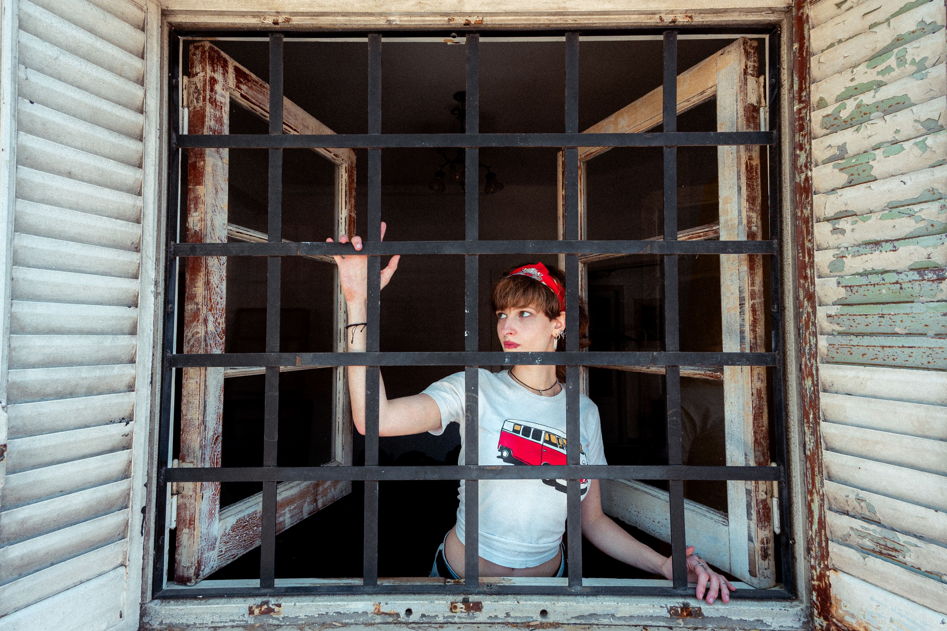 Vintage Styled Woman at Barred Window · Free Stock Photo