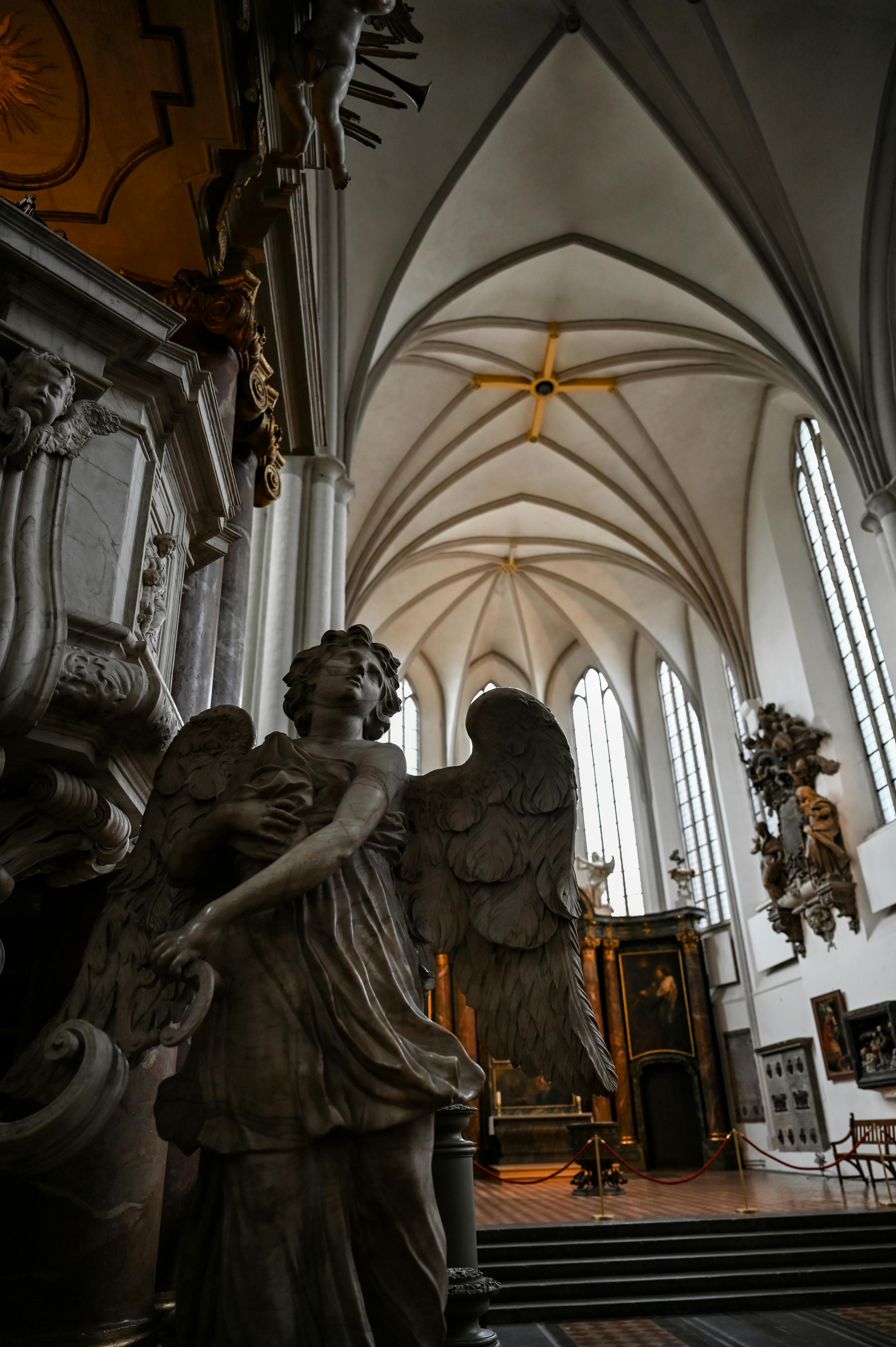 Gothic Church Interior with Angel Statue · Free Stock Photo