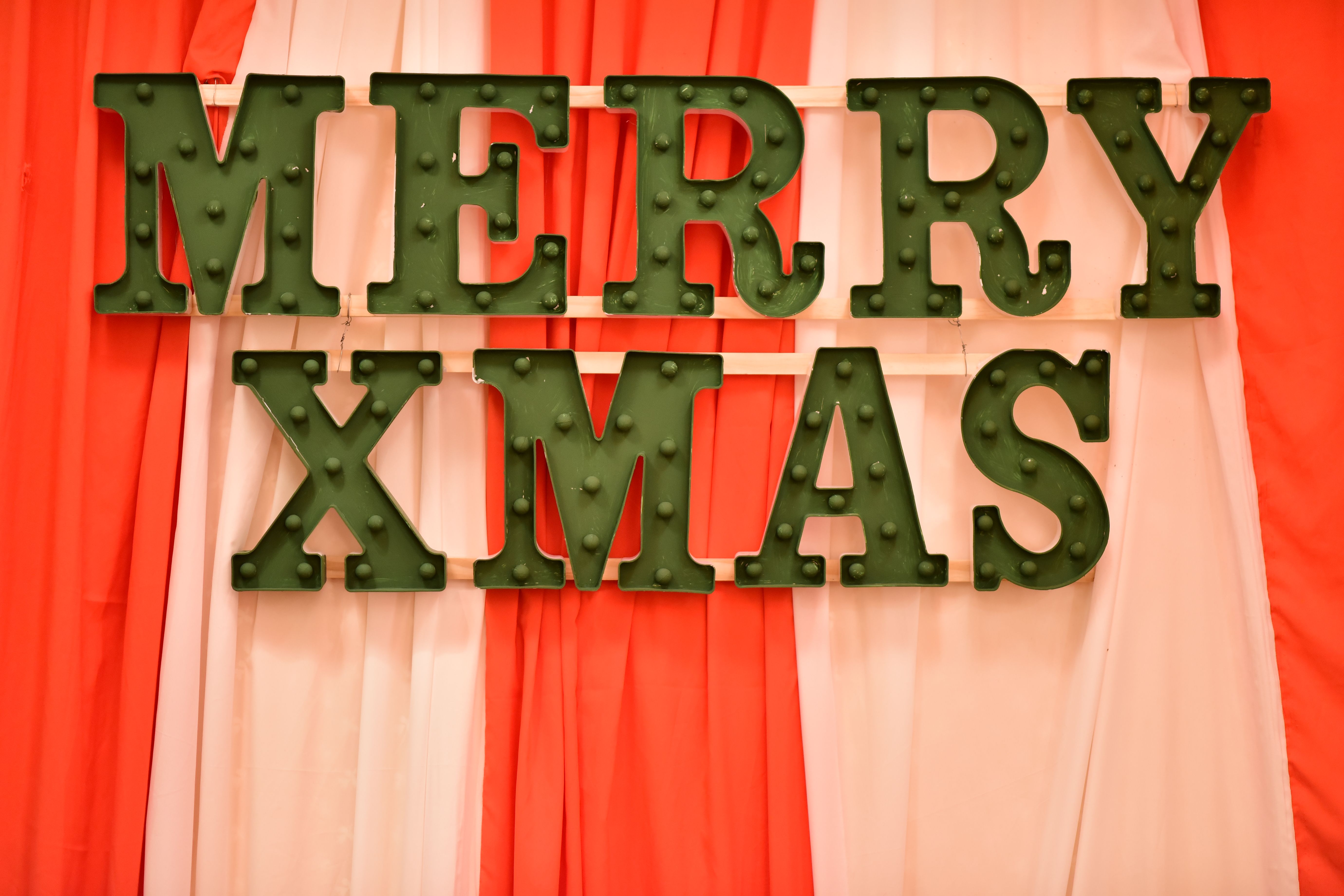 Festive Merry Xmas Sign with Red Background · Free Stock Photo