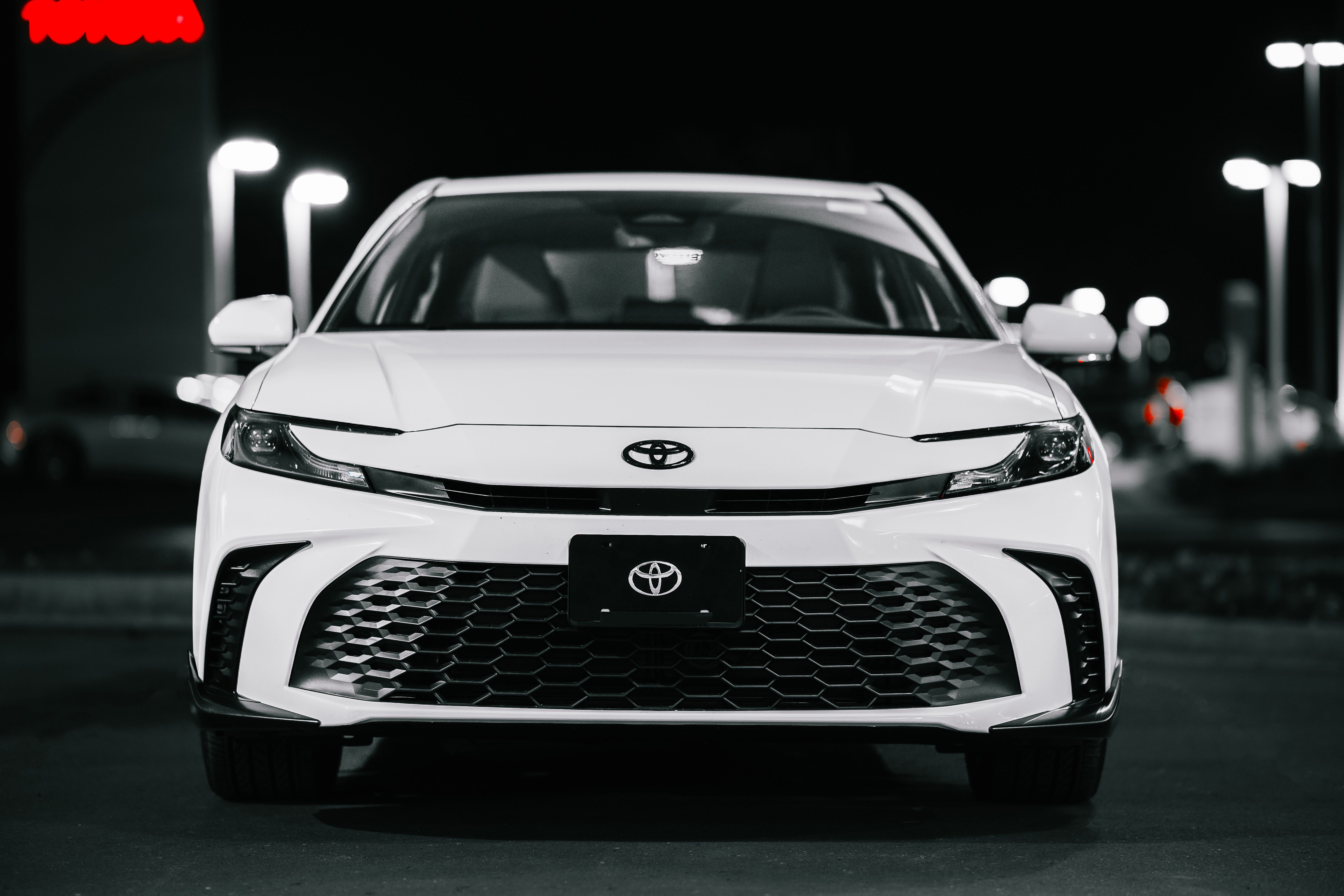 Front View of Modern White Sedan Car at Night · Free Stock Photo