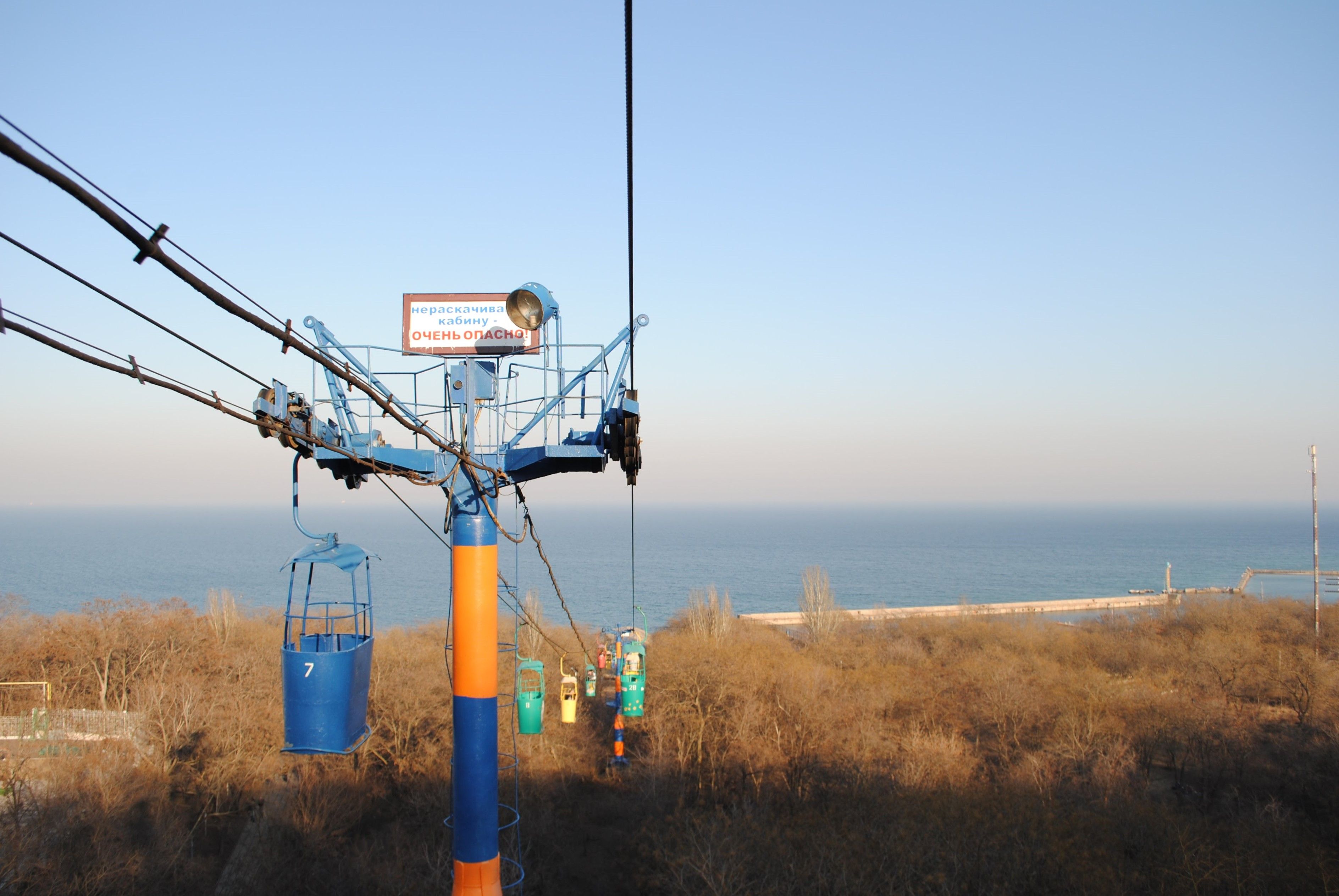 Scenic cable car ride over coastal landscape · Free Stock Photo