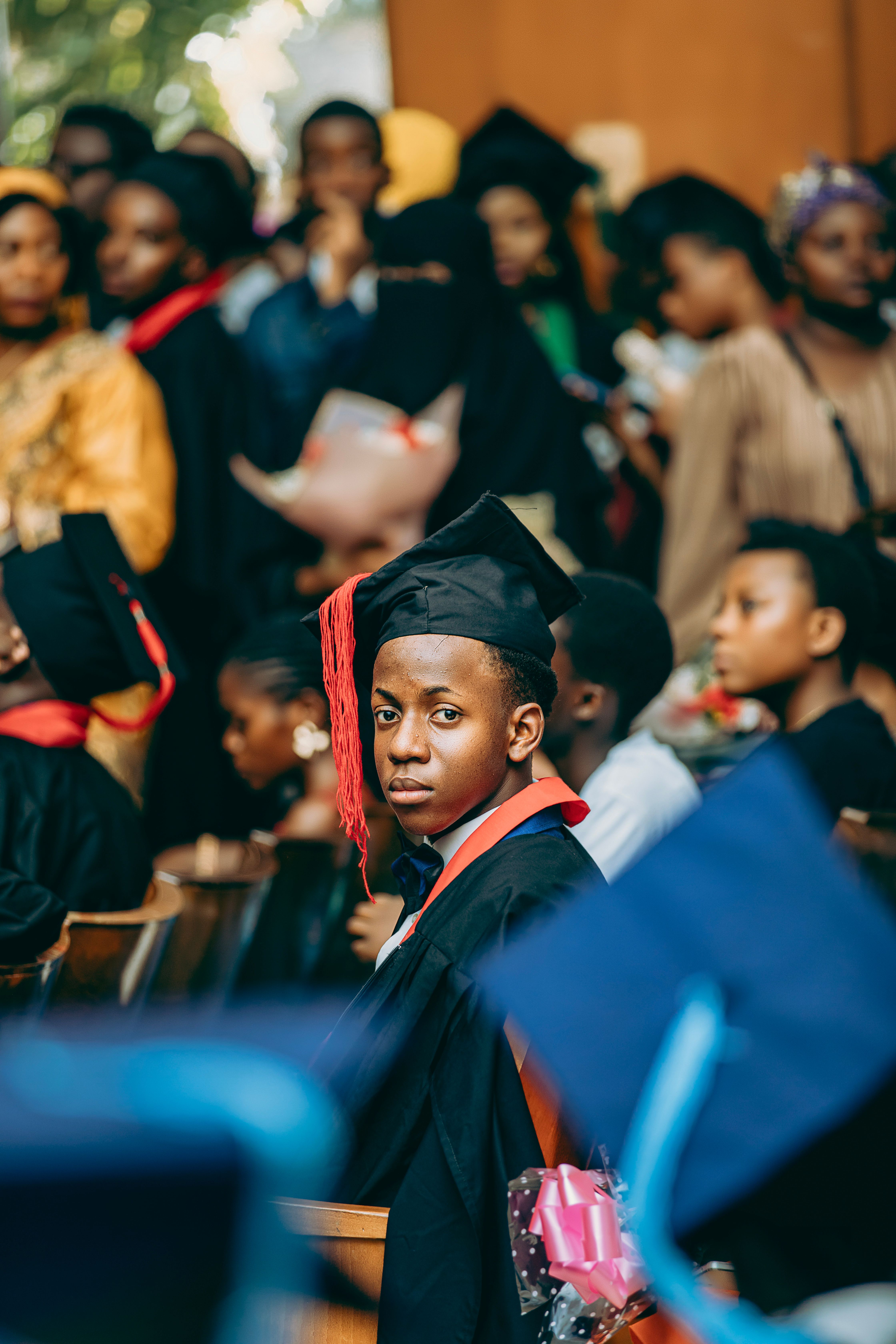 Young Graduate at Graduation Ceremony · Free Stock Photo