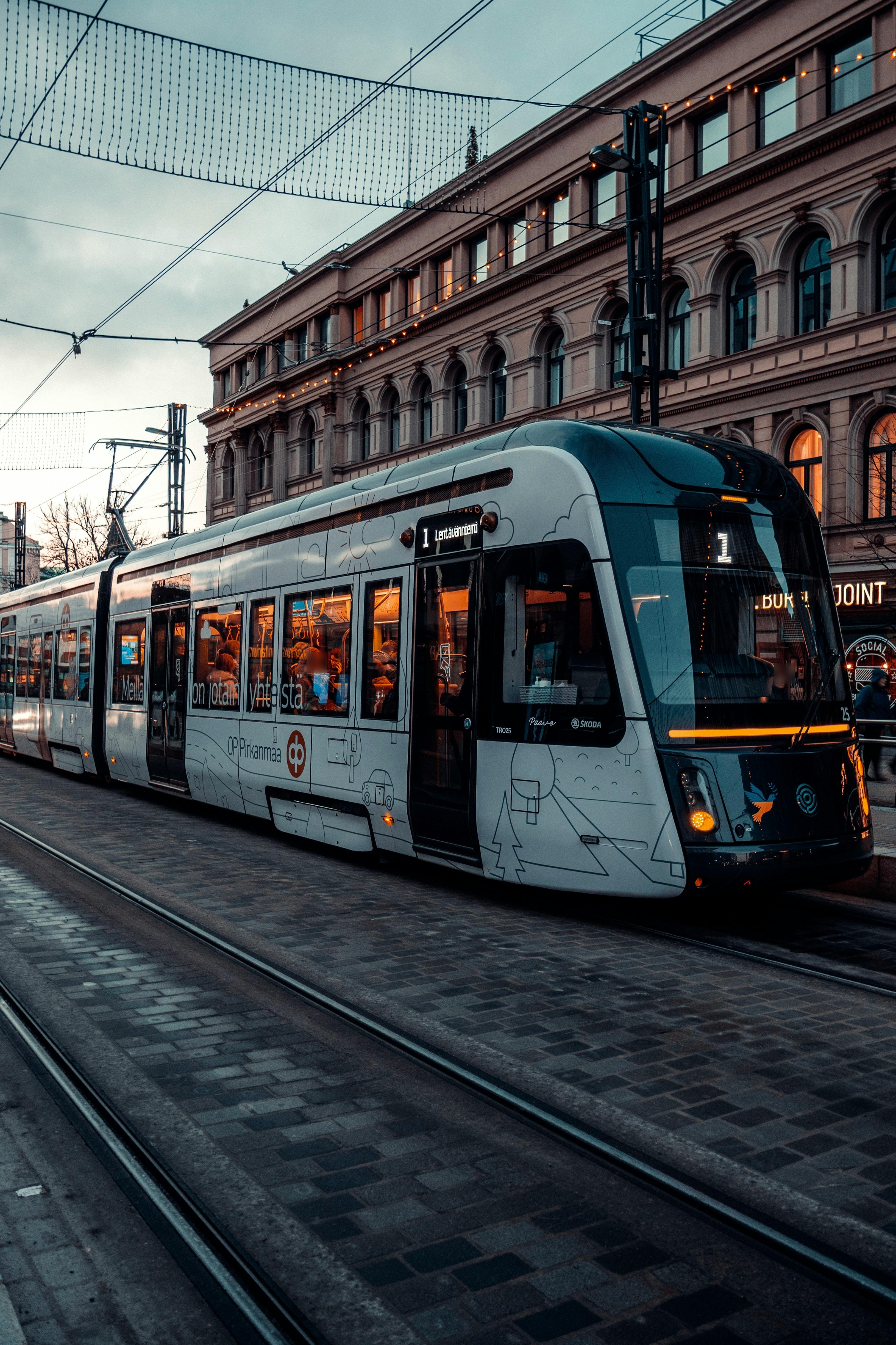 Modern Tram on Tampere Street at Dusk · Free Stock Photo