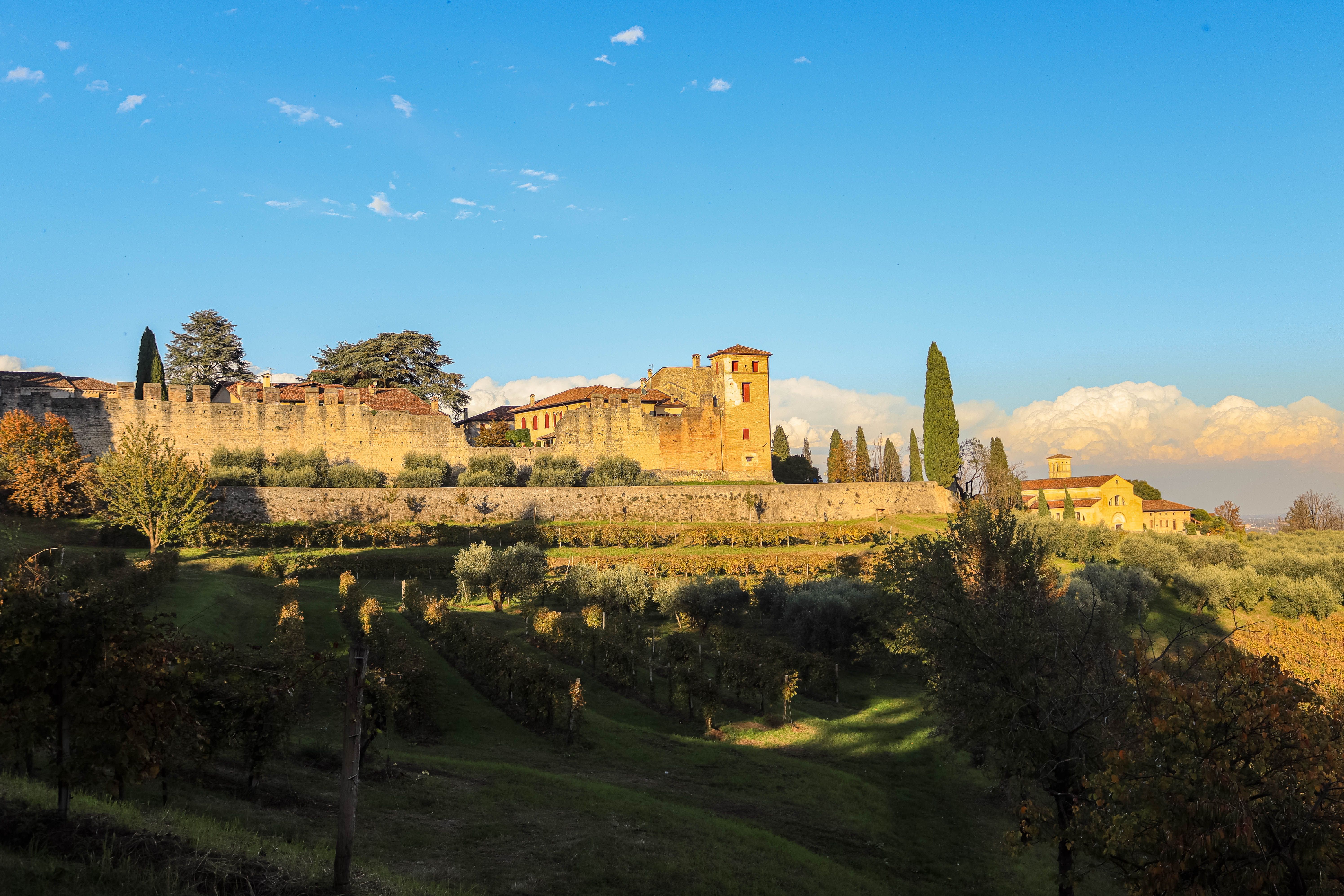 Scenic View of an Italian Stone Castle Under Bright Sky · Free Stock Photo