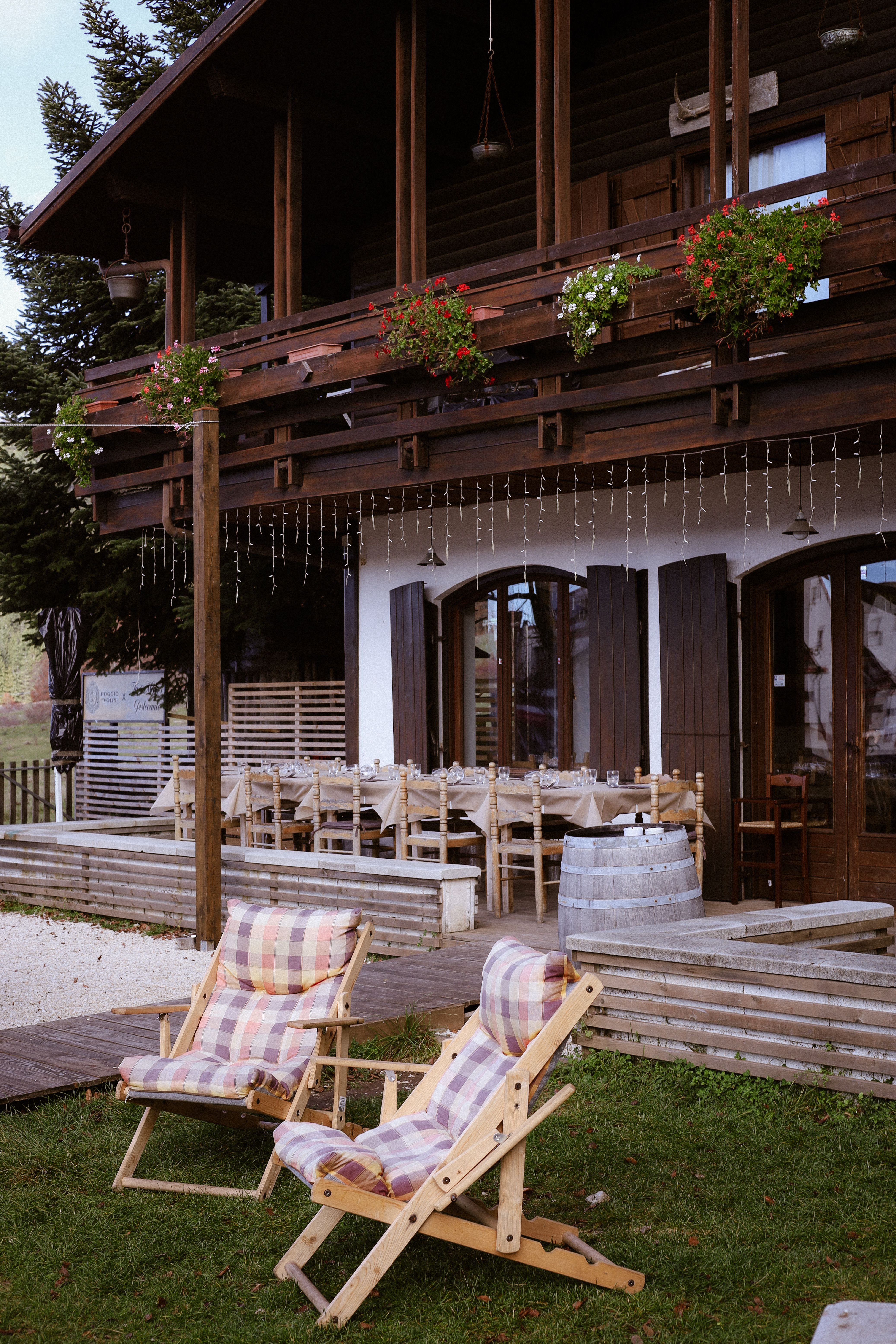 Charming Rustic Chalet with Outdoor Seating · Free Stock Photo