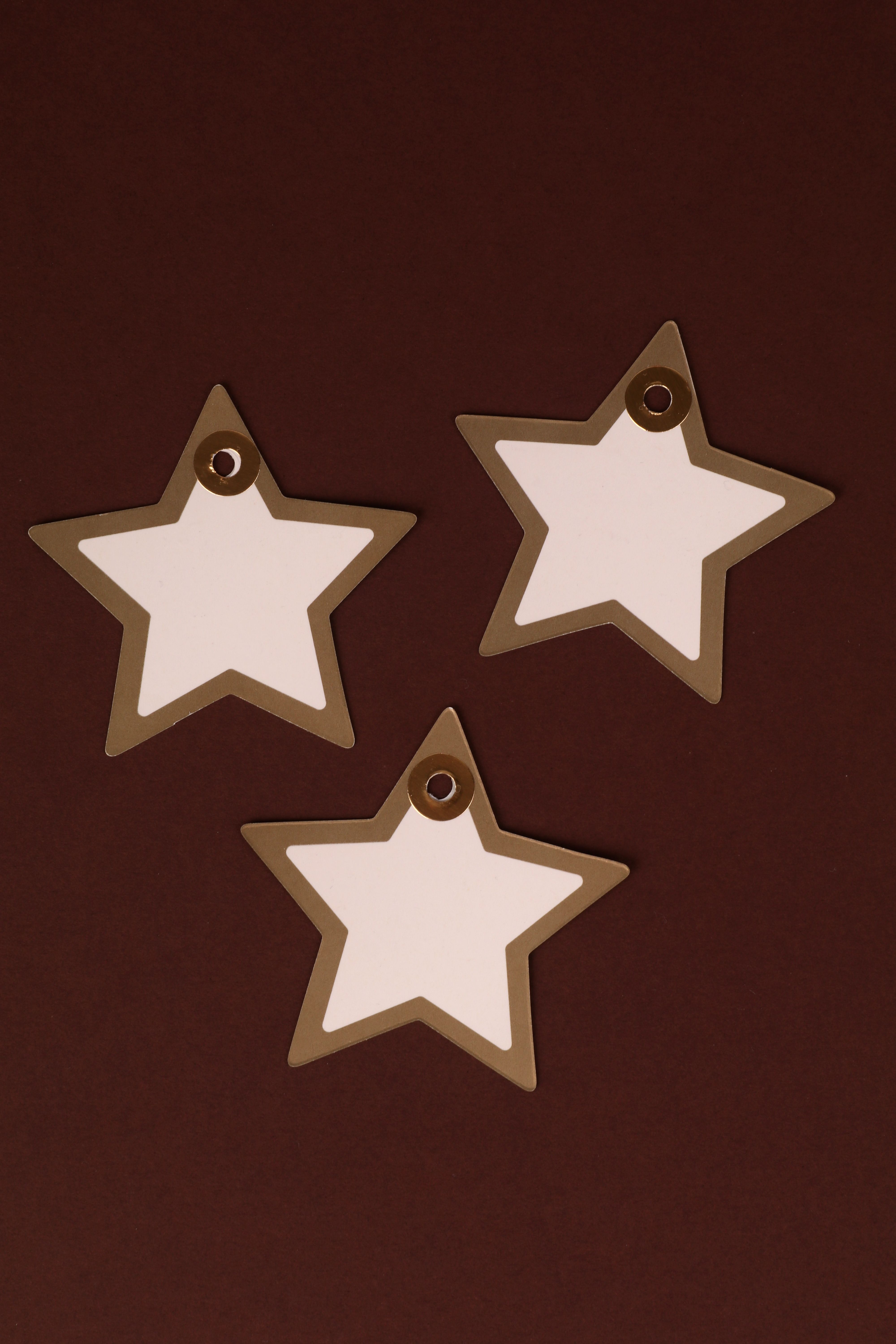 Star-Shaped Brown Cardboard Tags Arranged Flat · Free Stock Photo