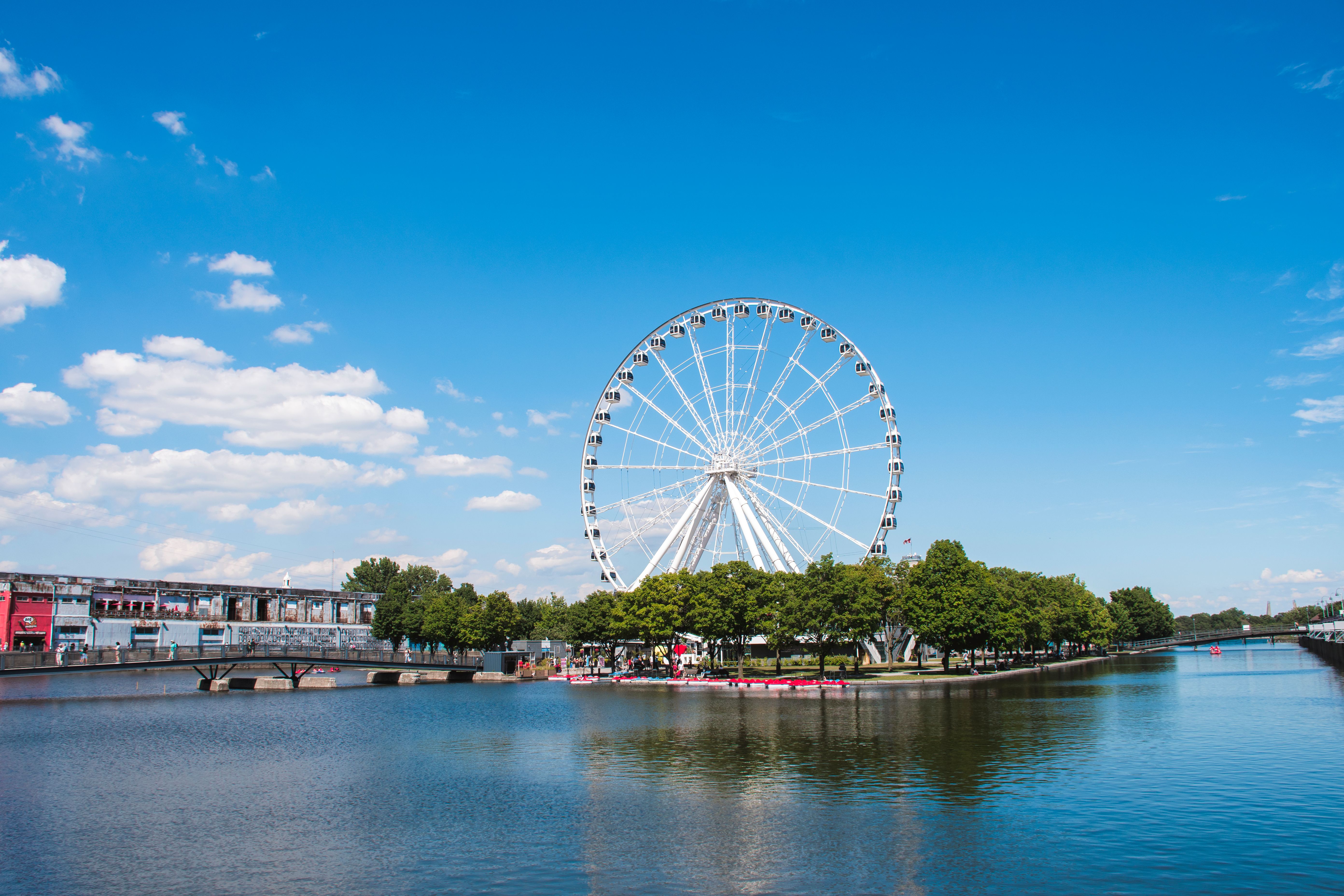 Scenic View of Ferris Wheel by Waterfront · Free Stock Photo